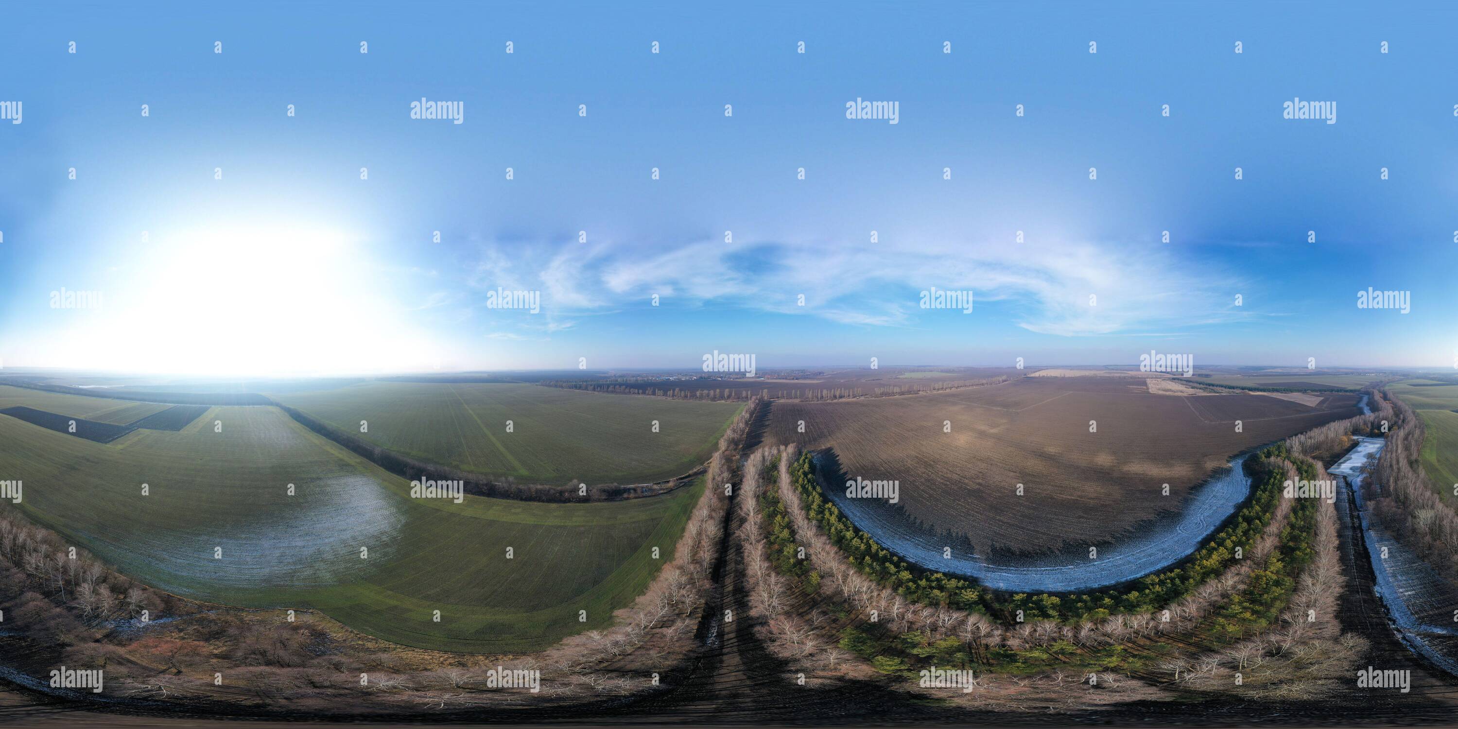 360° view of Top view in the middle of a icy river in the forest with ...