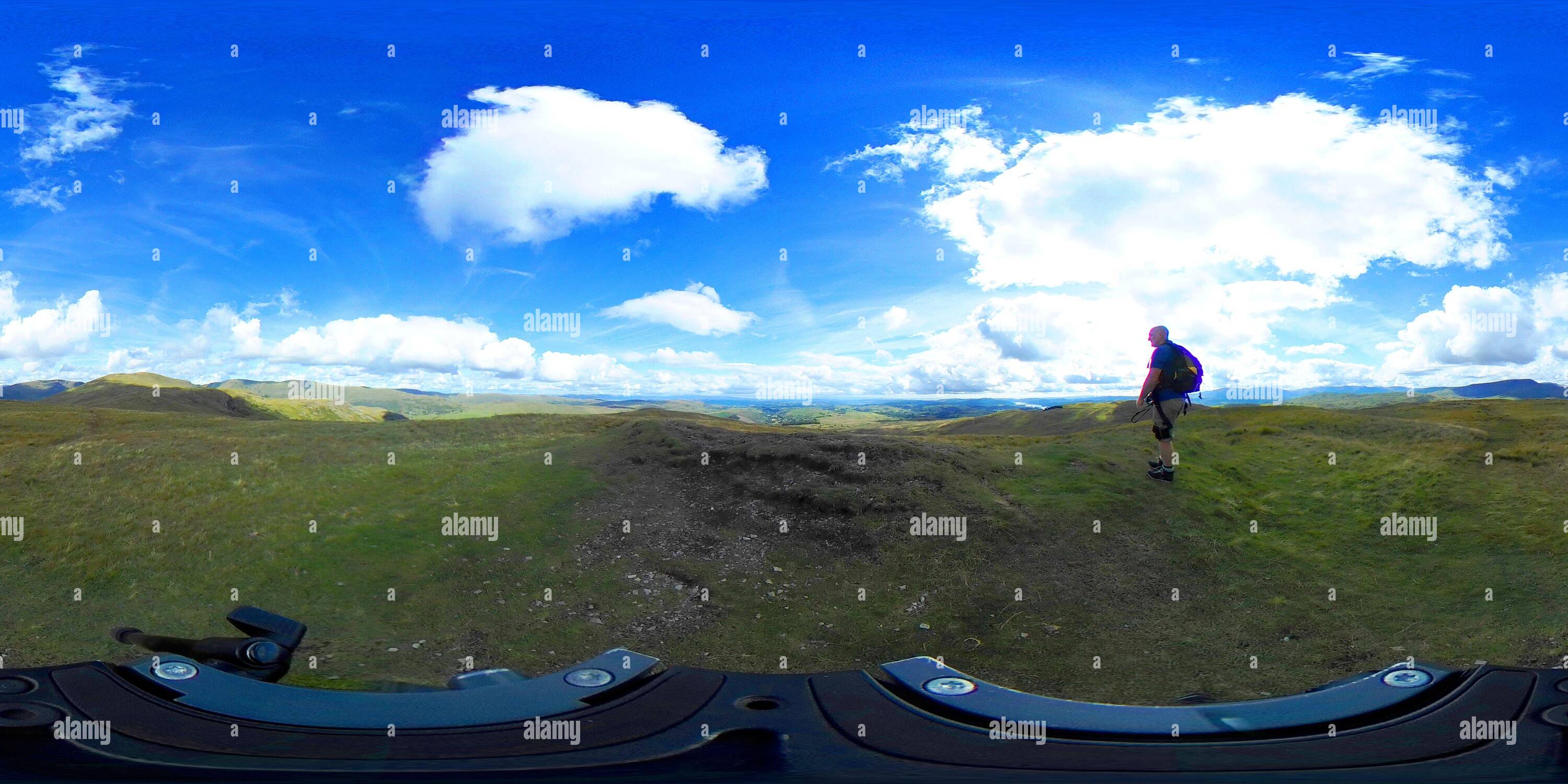 360° view of Walker at the Summit Cairn of Sallows fell, valley ...