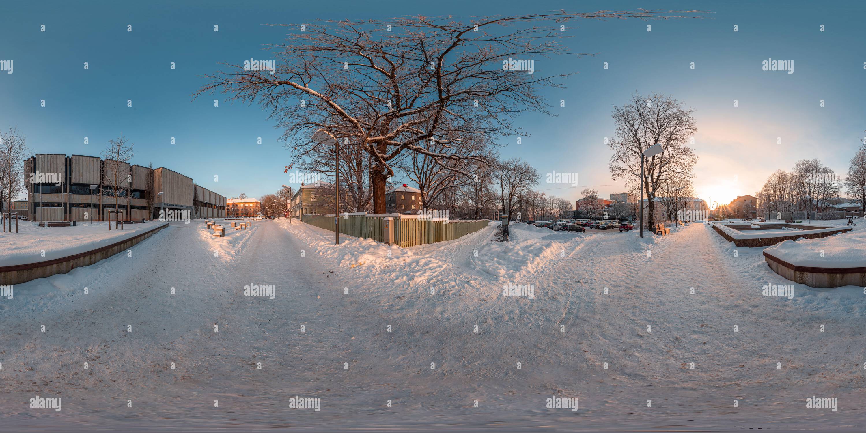 360° view of Winter city view with warm sunlight on white fluffy snow ...