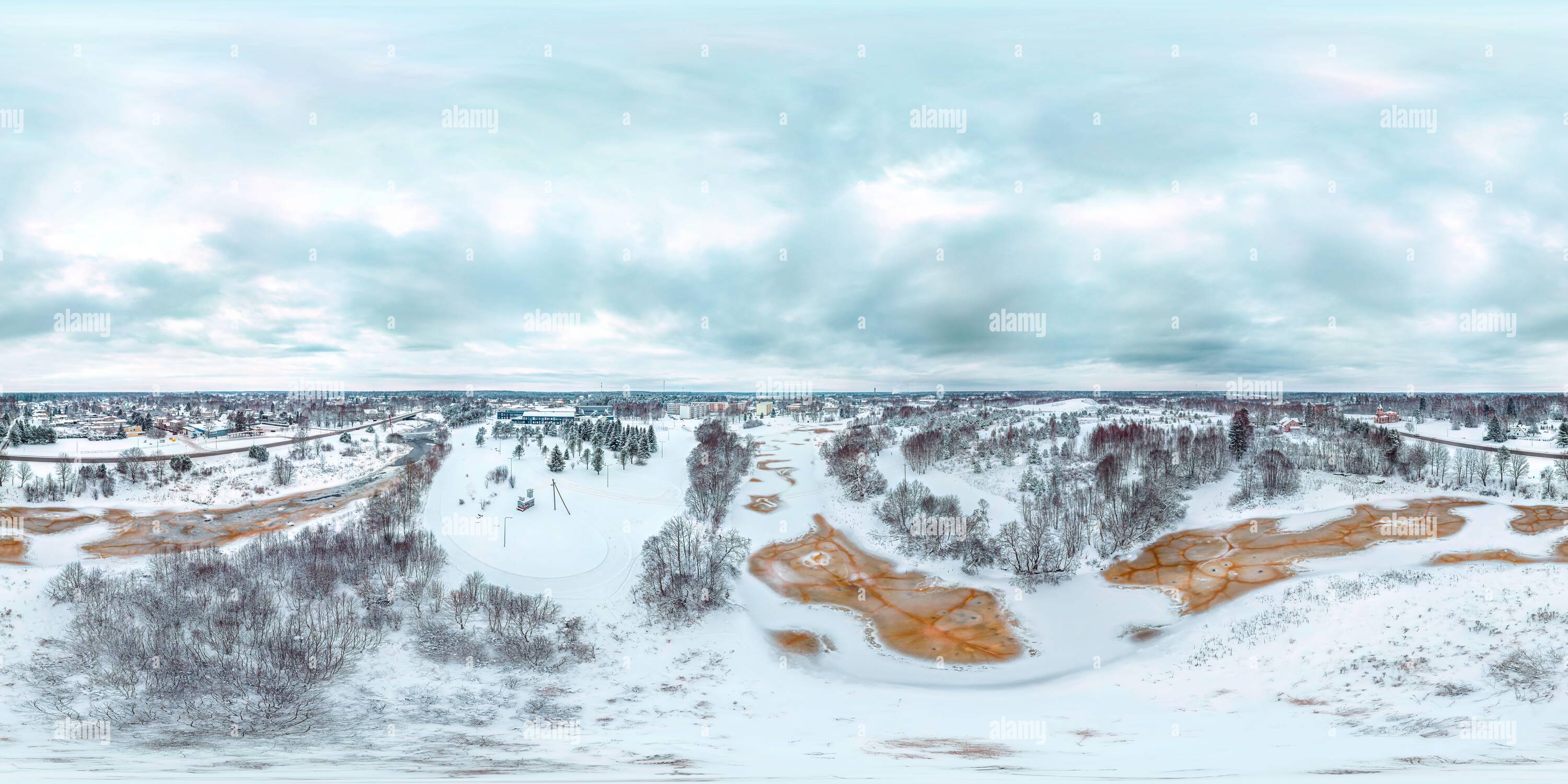 360° view of Snowy small town winter landscape drone shot with a frozen ...