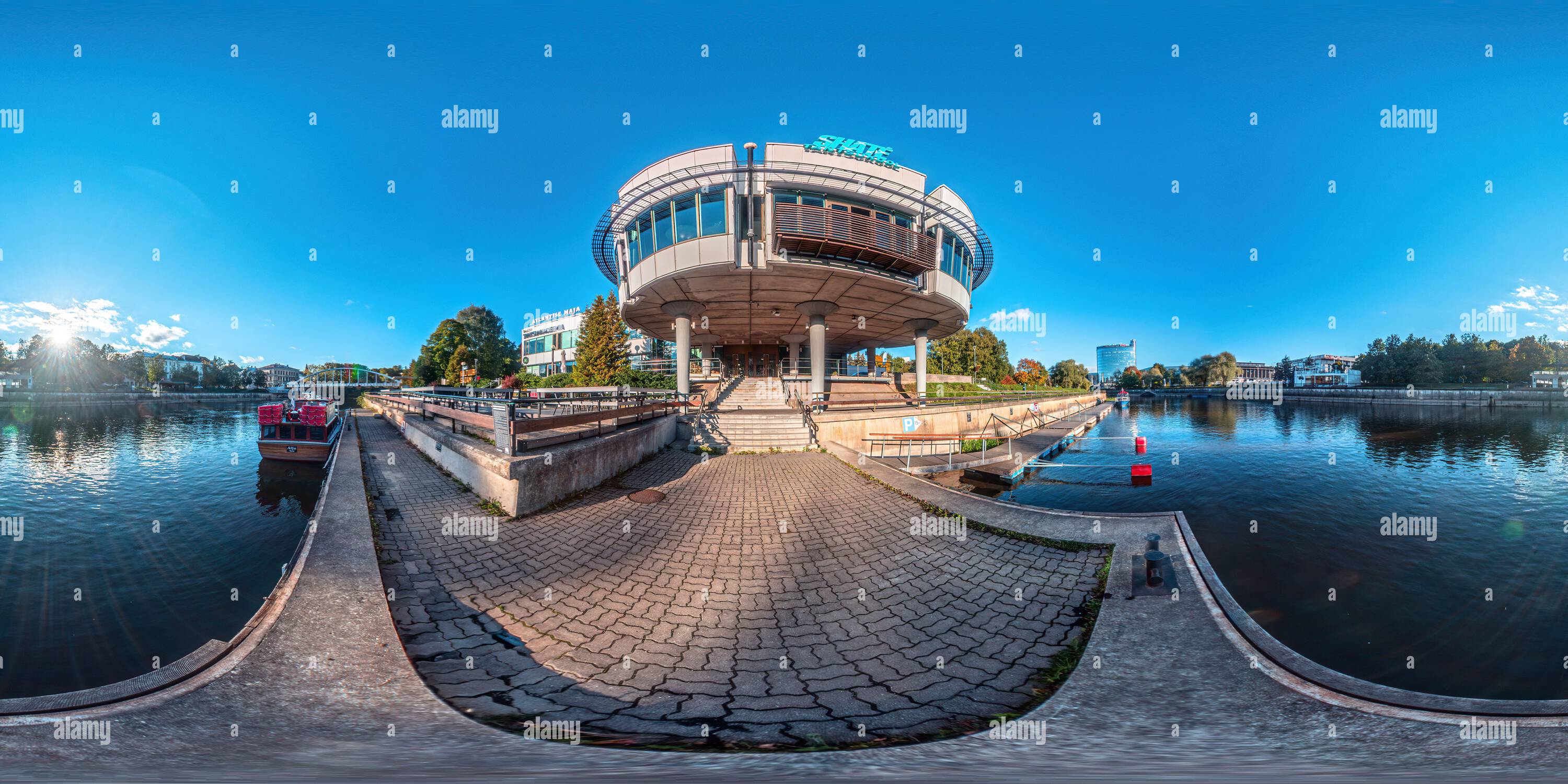 360° view of A riverside port in a small town during autumn with lots ...