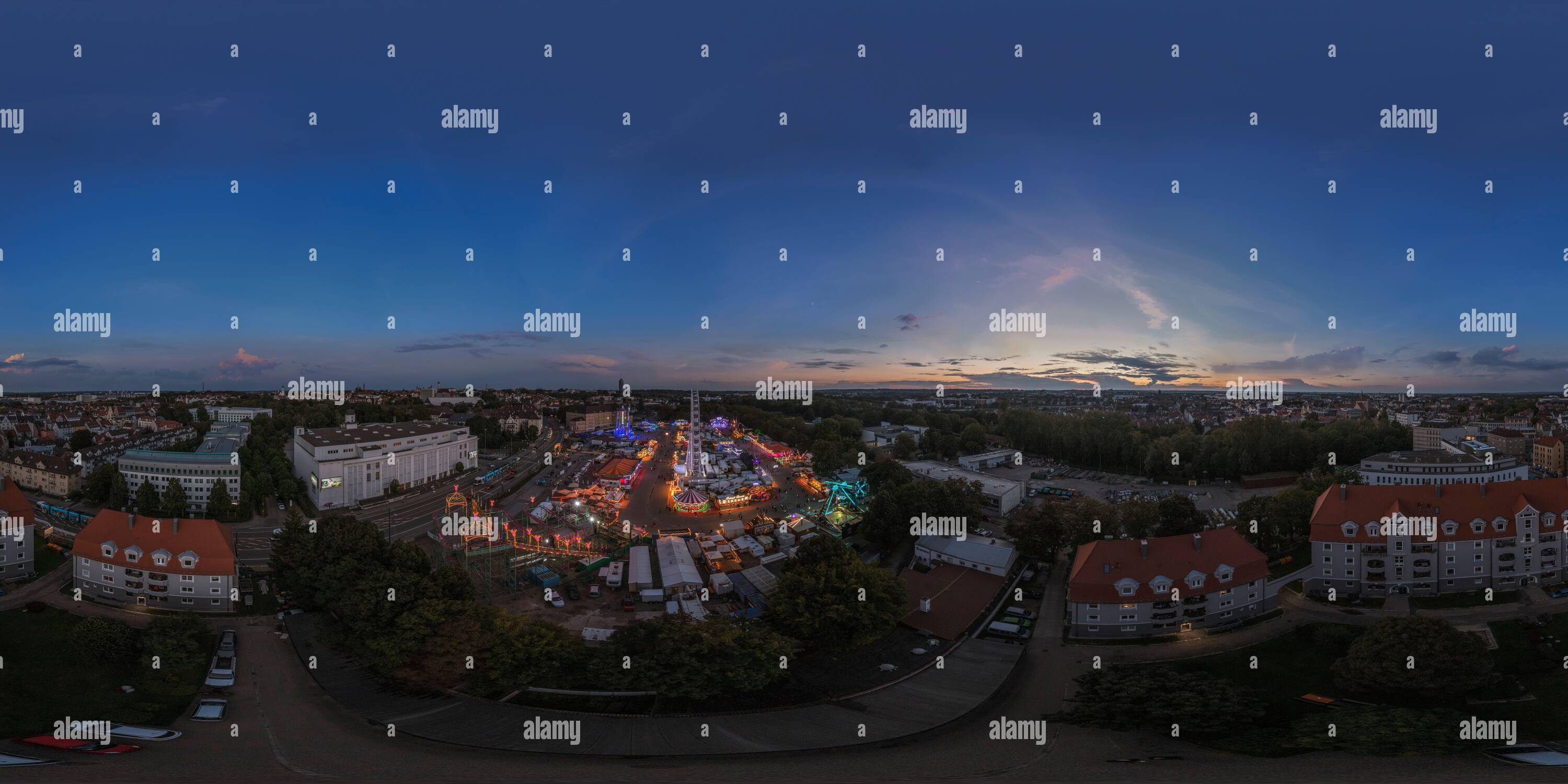 360° view of 360°- colorful illuminated fairground attractions on ...