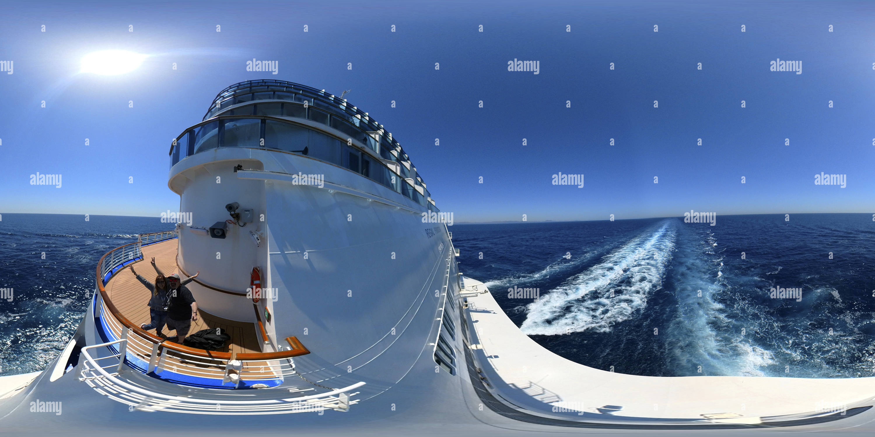 360° view of Couple standing at the back of the Regal Princess Cruise ...