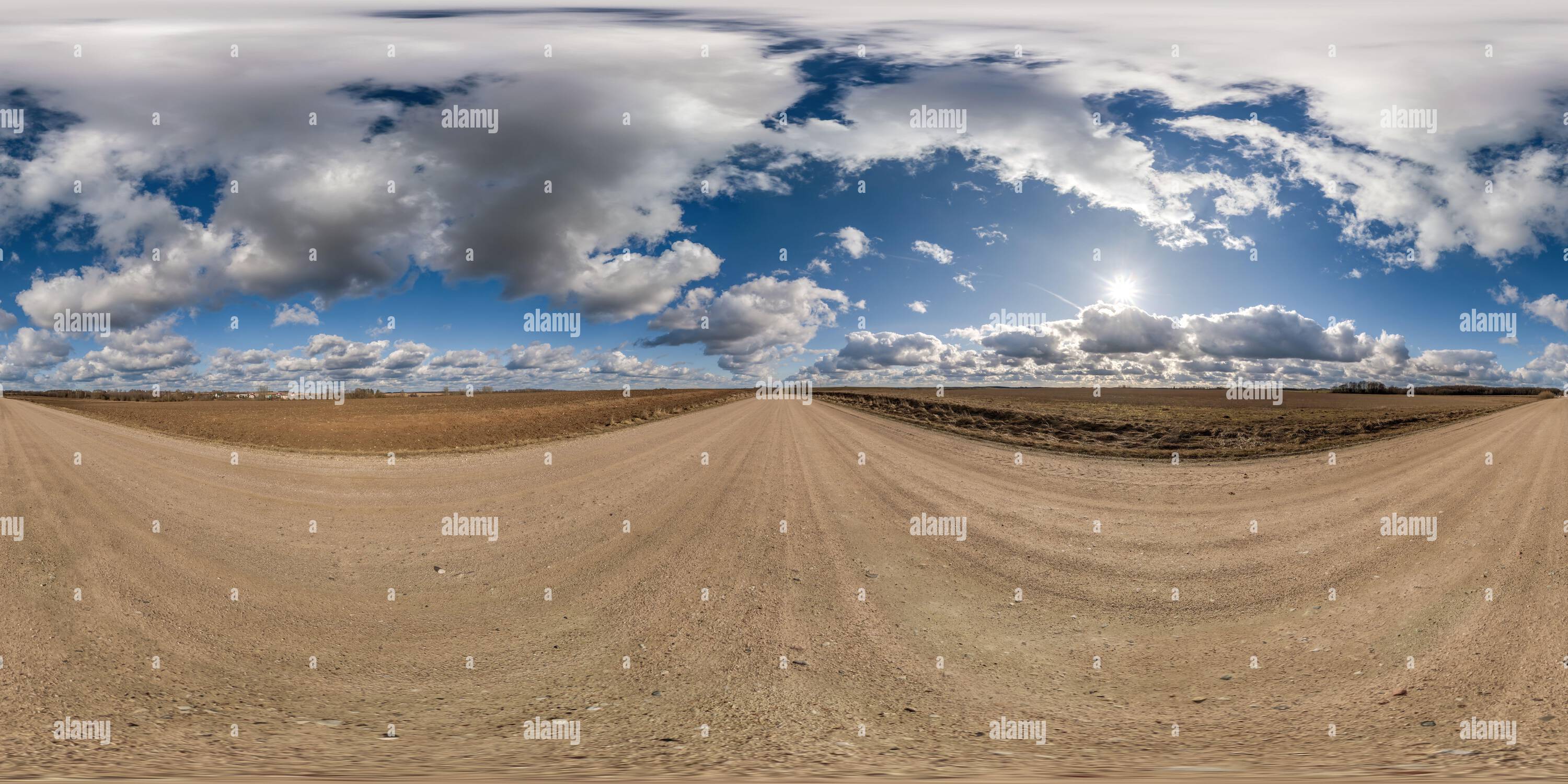 360° view of spherical 360 hdri panorama on gravel road with clouds on ...
