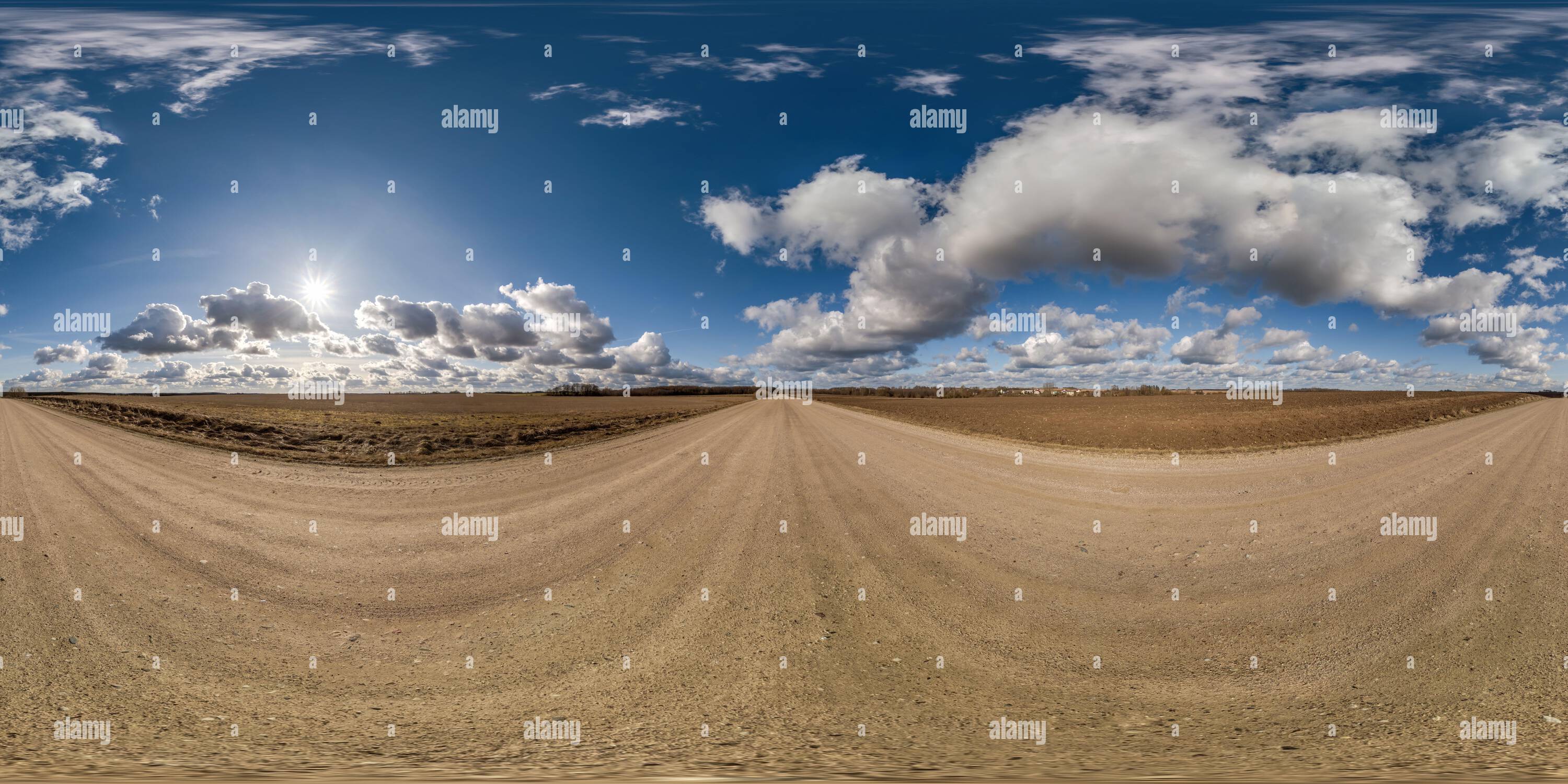 360° view of spherical 360 hdri panorama on gravel road with clouds on ...