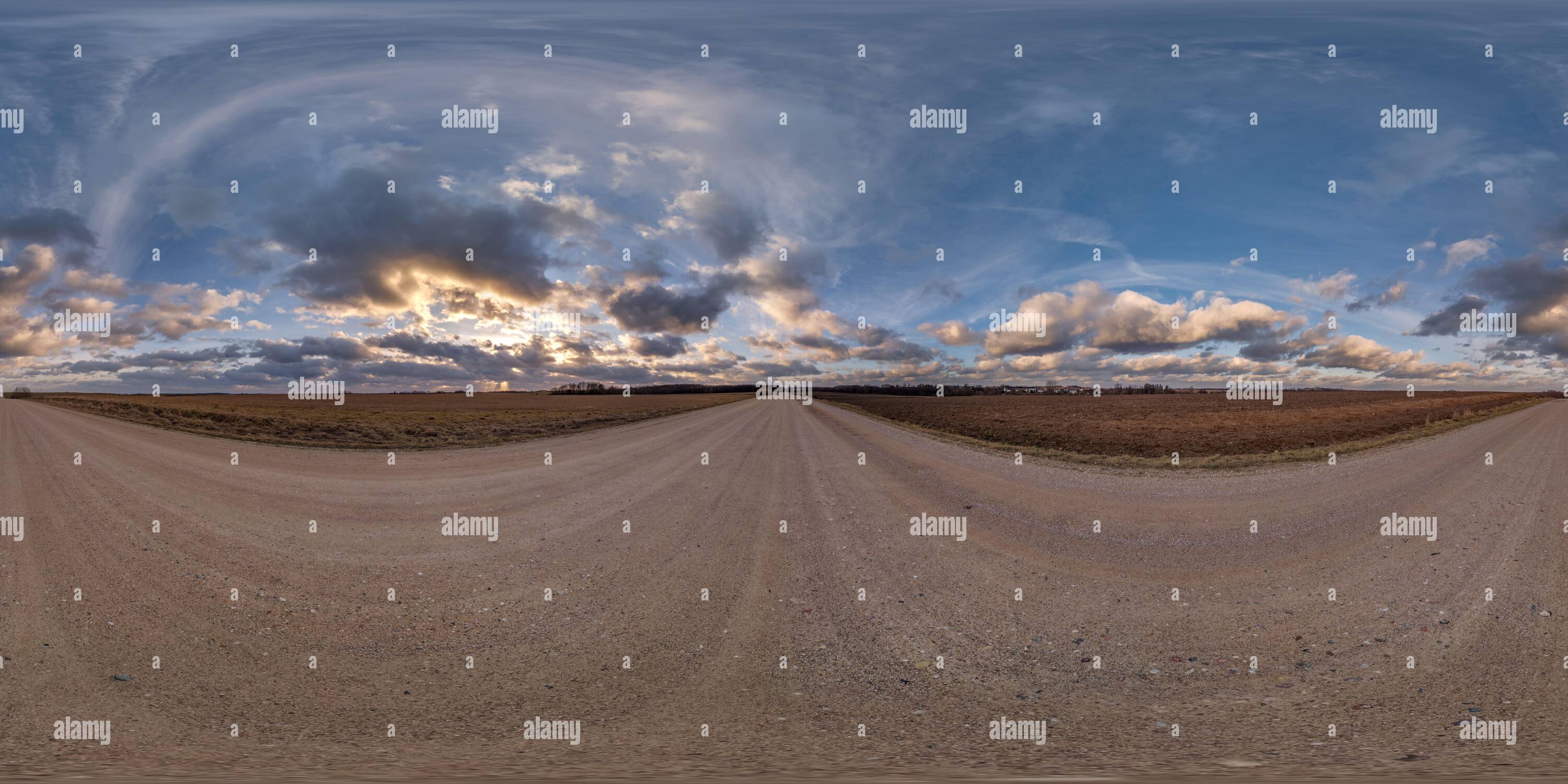 360° view of evening 360 hdri panorama on gravel road with clouds on ...