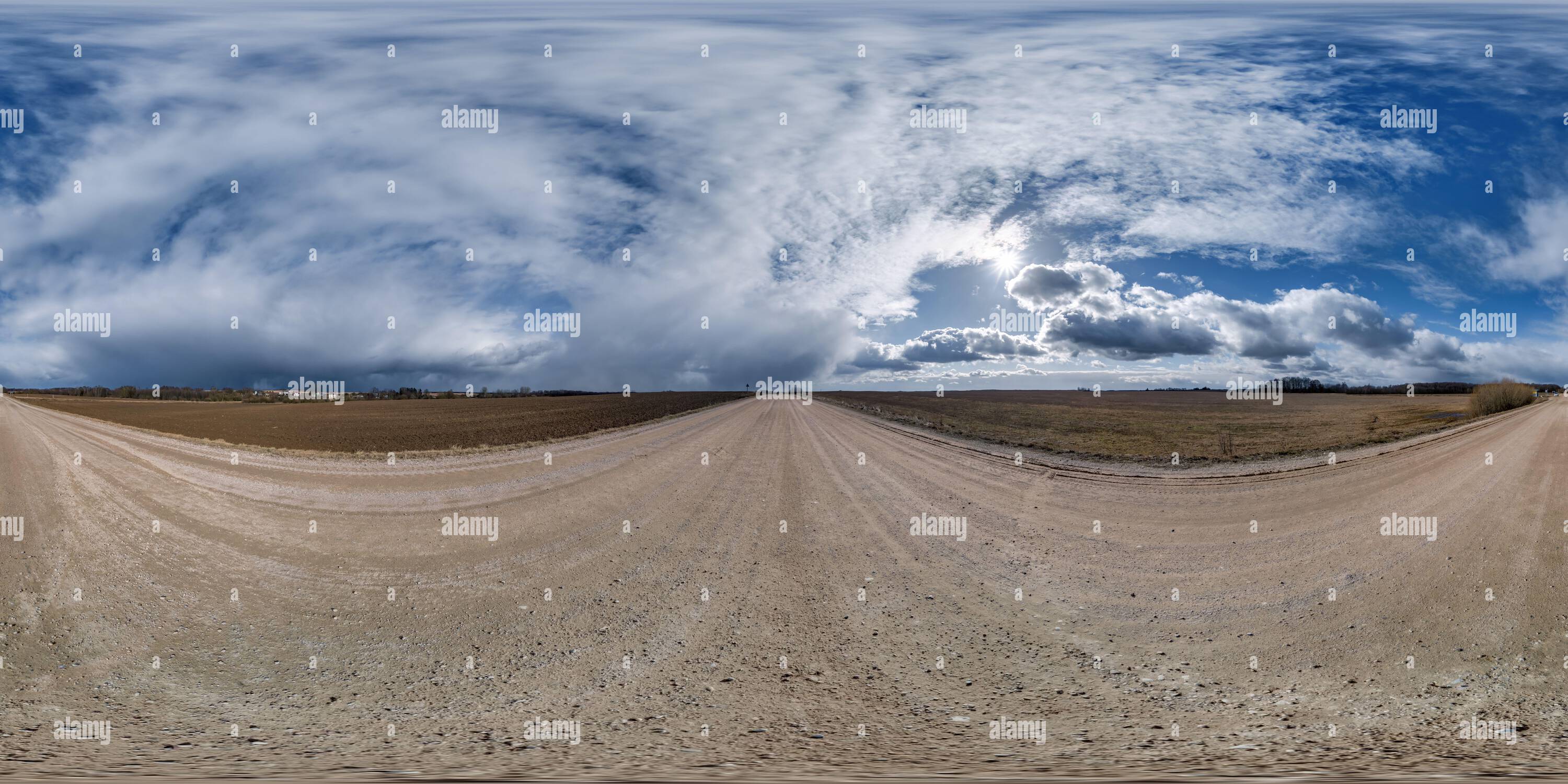 360° view of spherical 360 hdri panorama on gravel road with clouds on ...
