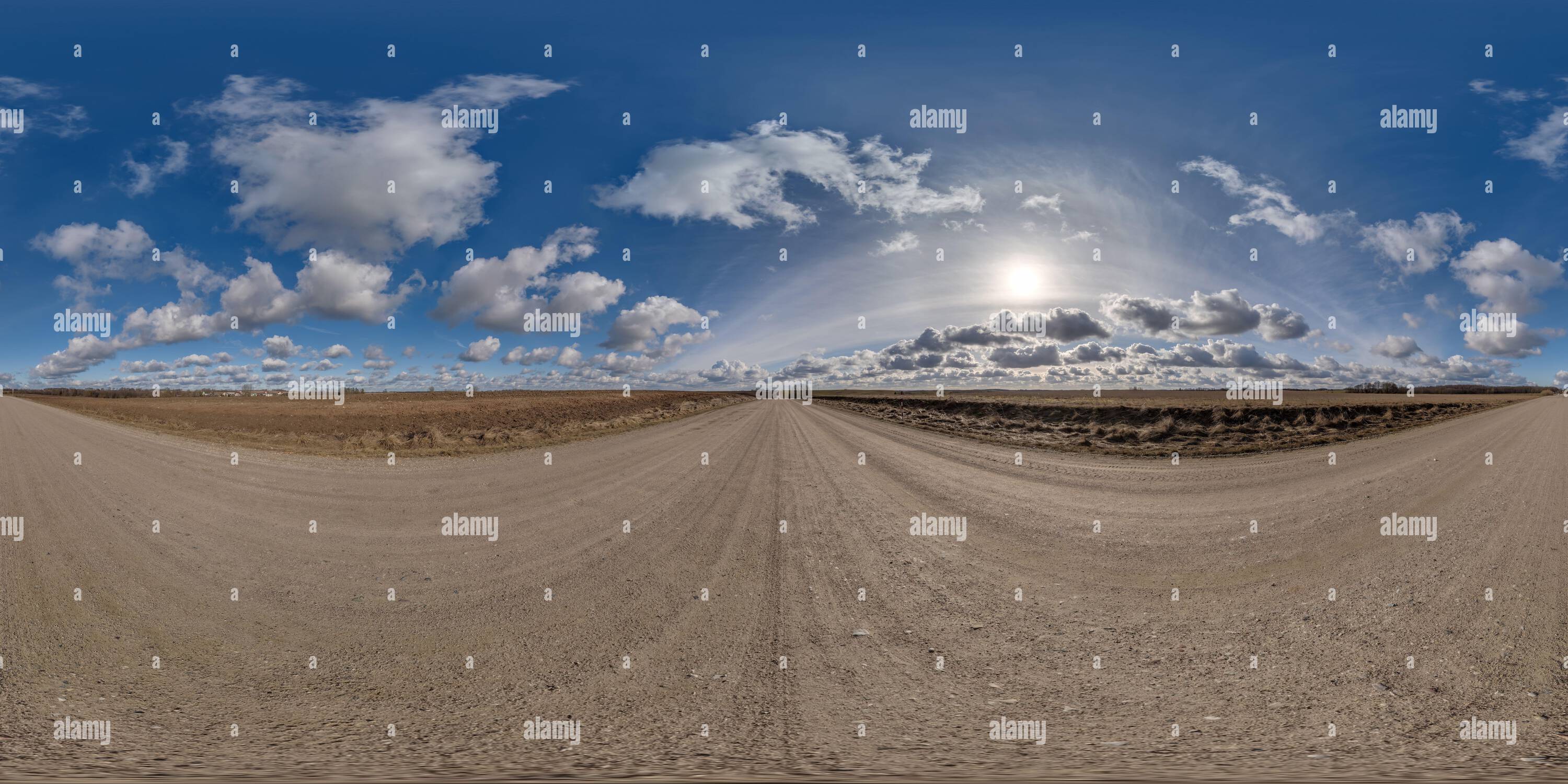 360° view of spherical 360 hdri panorama on gravel road with clouds on ...