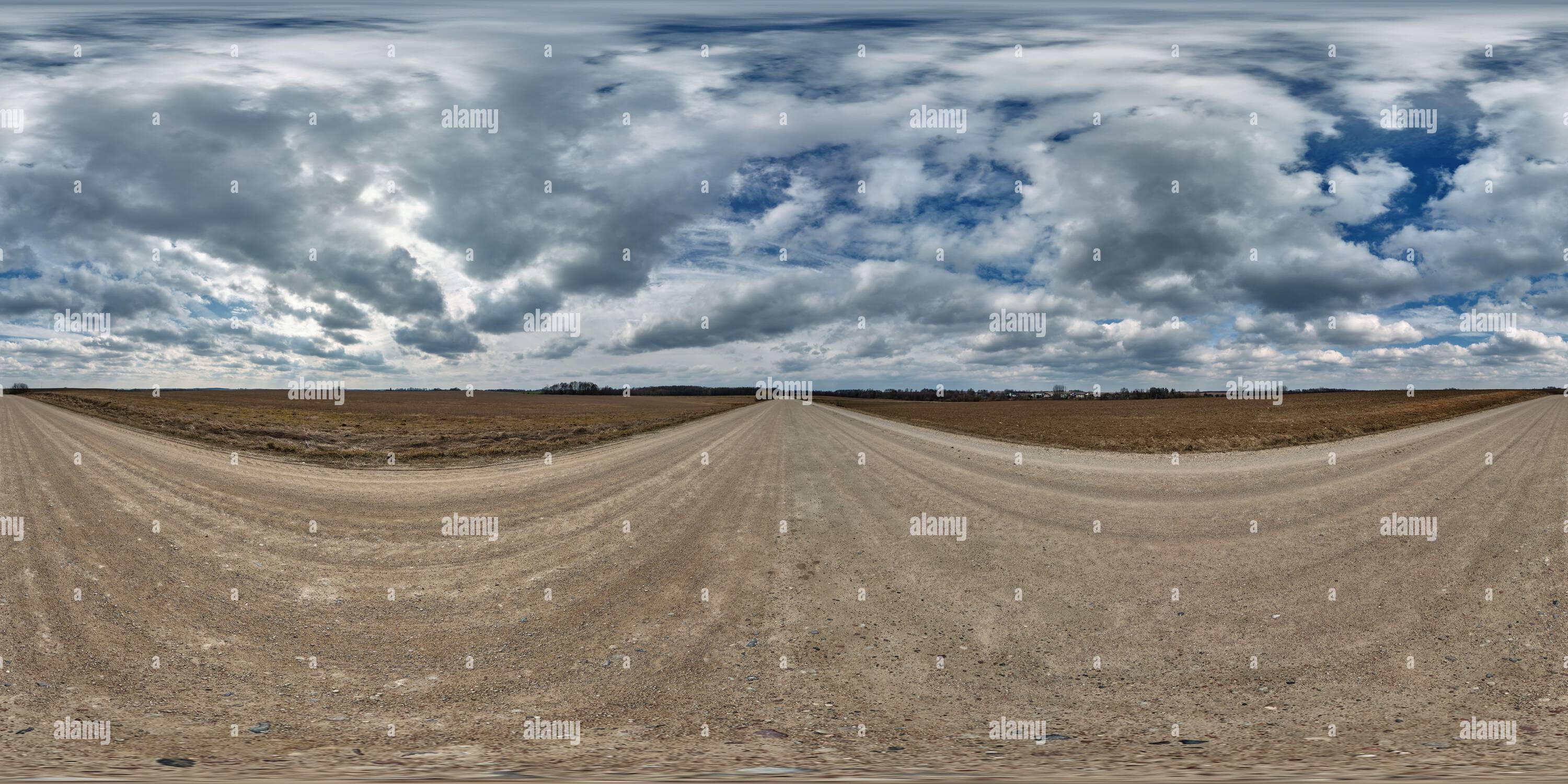 360° view of evening 360 hdri panorama on gravel road with clouds on ...