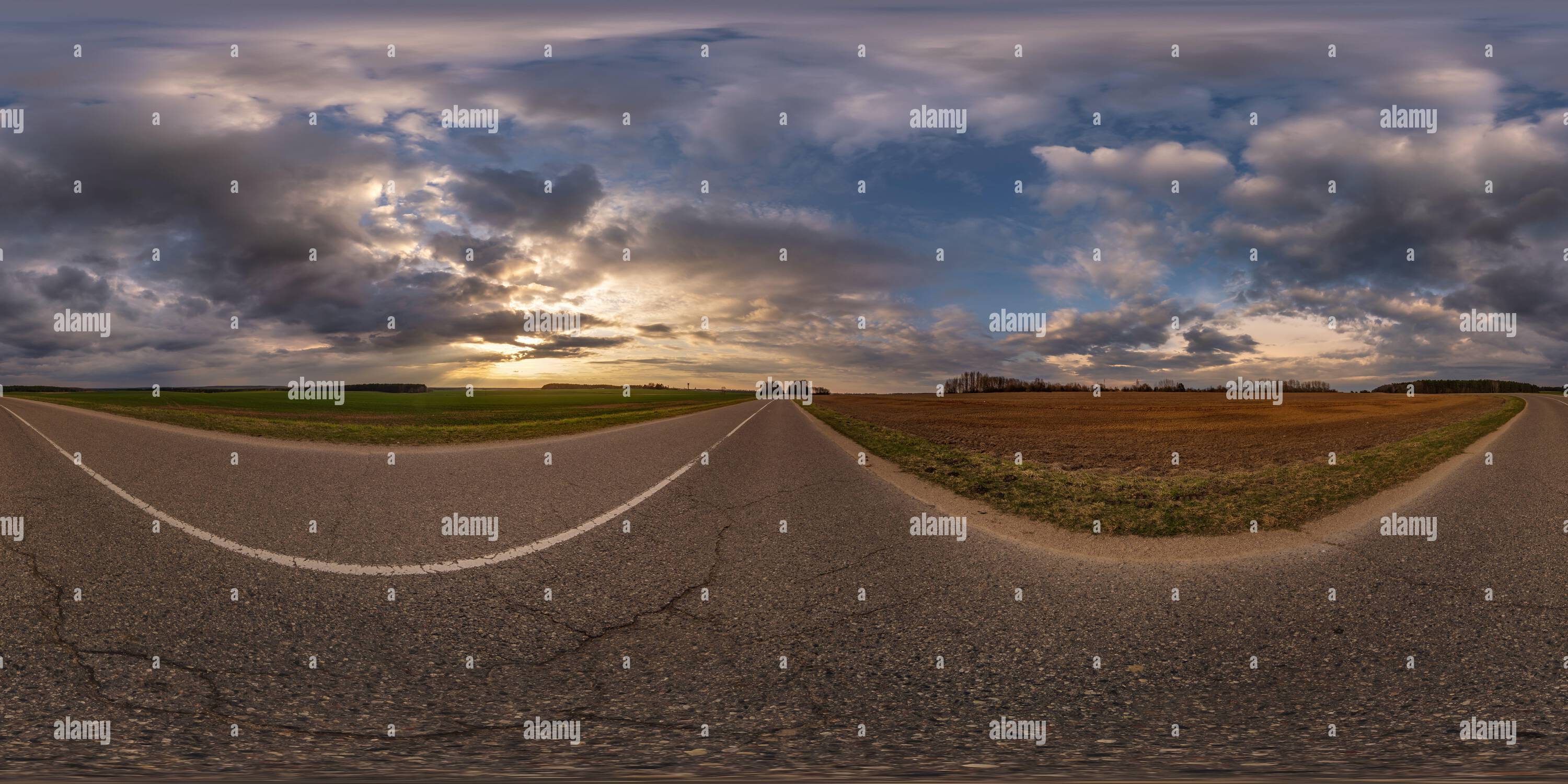 360° view of 360 hdri panorama near asphalt road with evening clouds on ...
