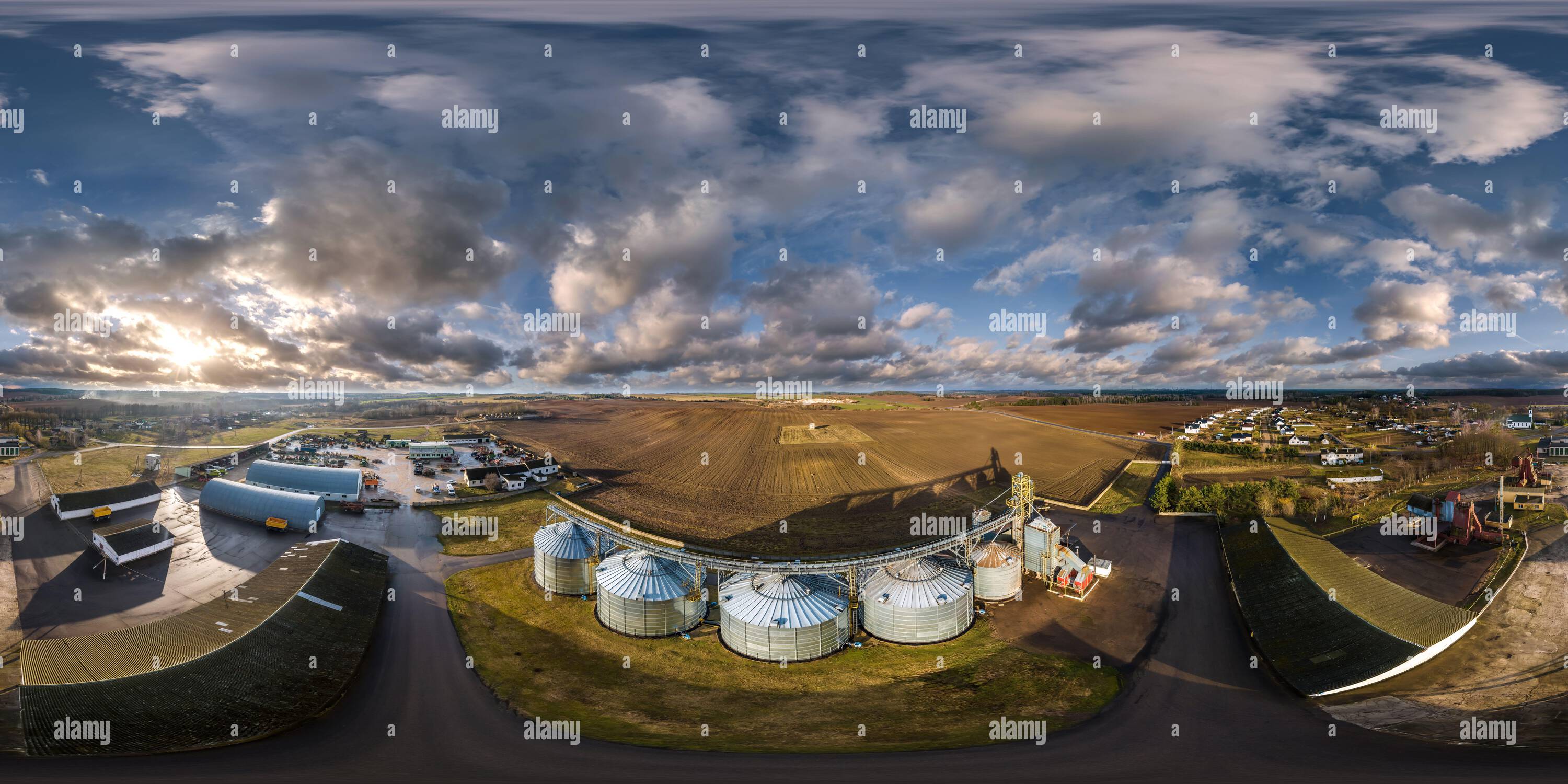 360° view of full seamless 360 hdri panorama over rows of agro silos ...