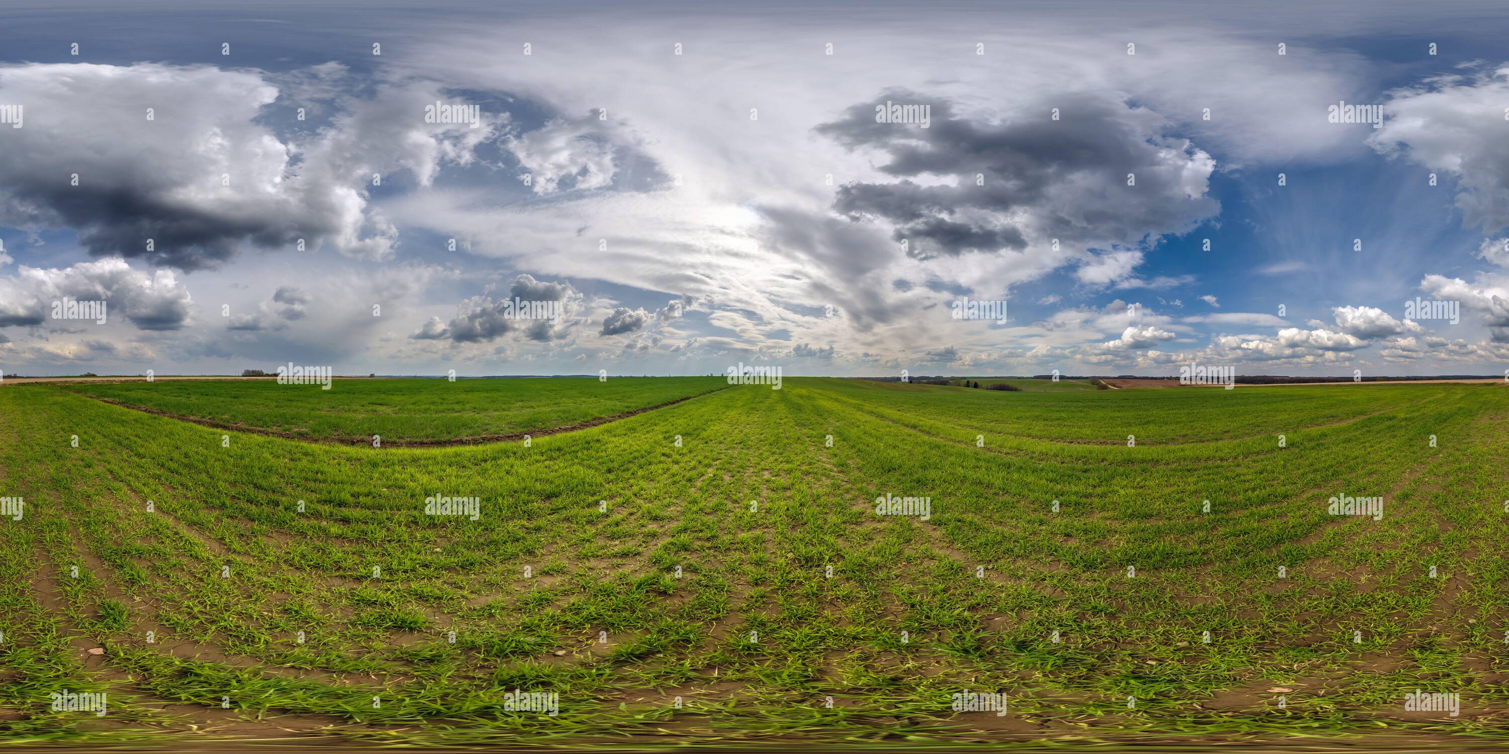 360° view of 360 hdri panorama on green grass farming field with clouds ...