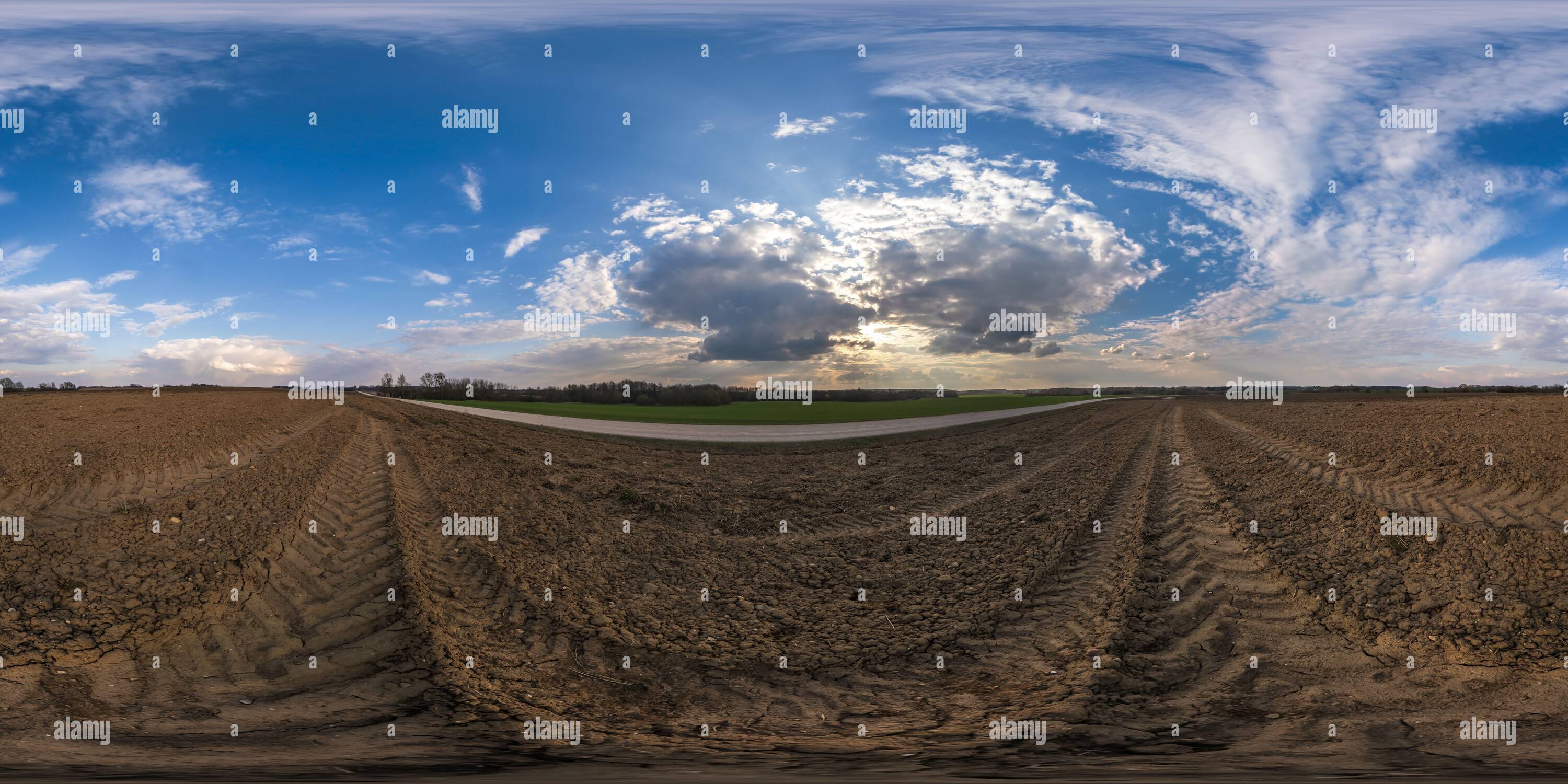 360° view of 360 hdri panorama view among fields with sunset sky in ...