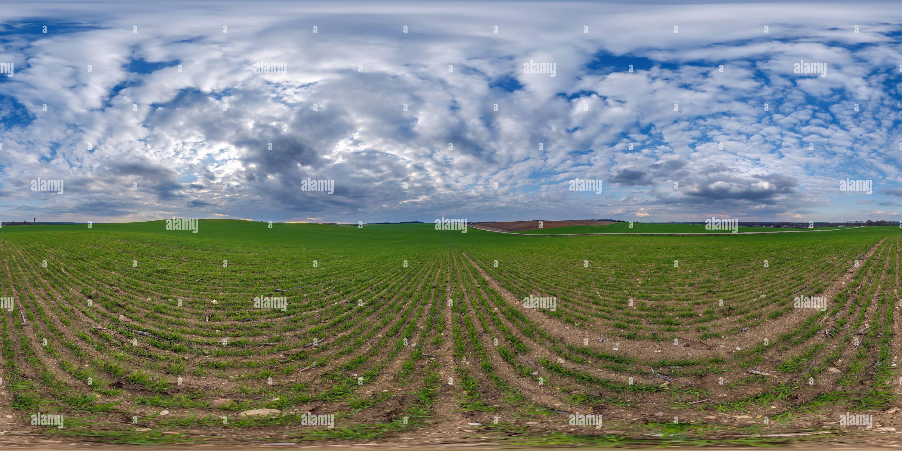 360° view of 360 hdri panorama on green grass farming field with clouds ...