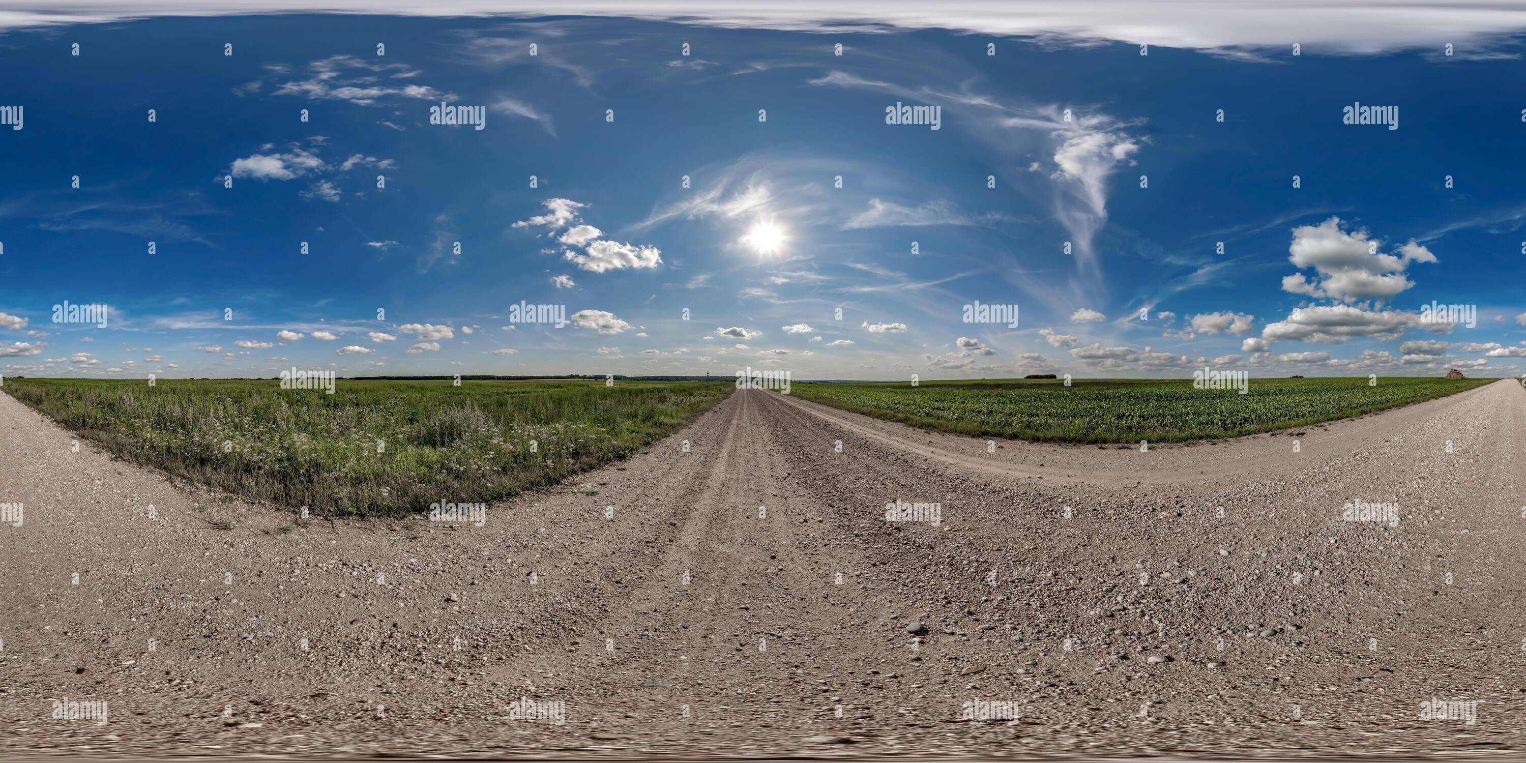 360° view of 360 hdri panorama on wet gravel road with marks from car ...