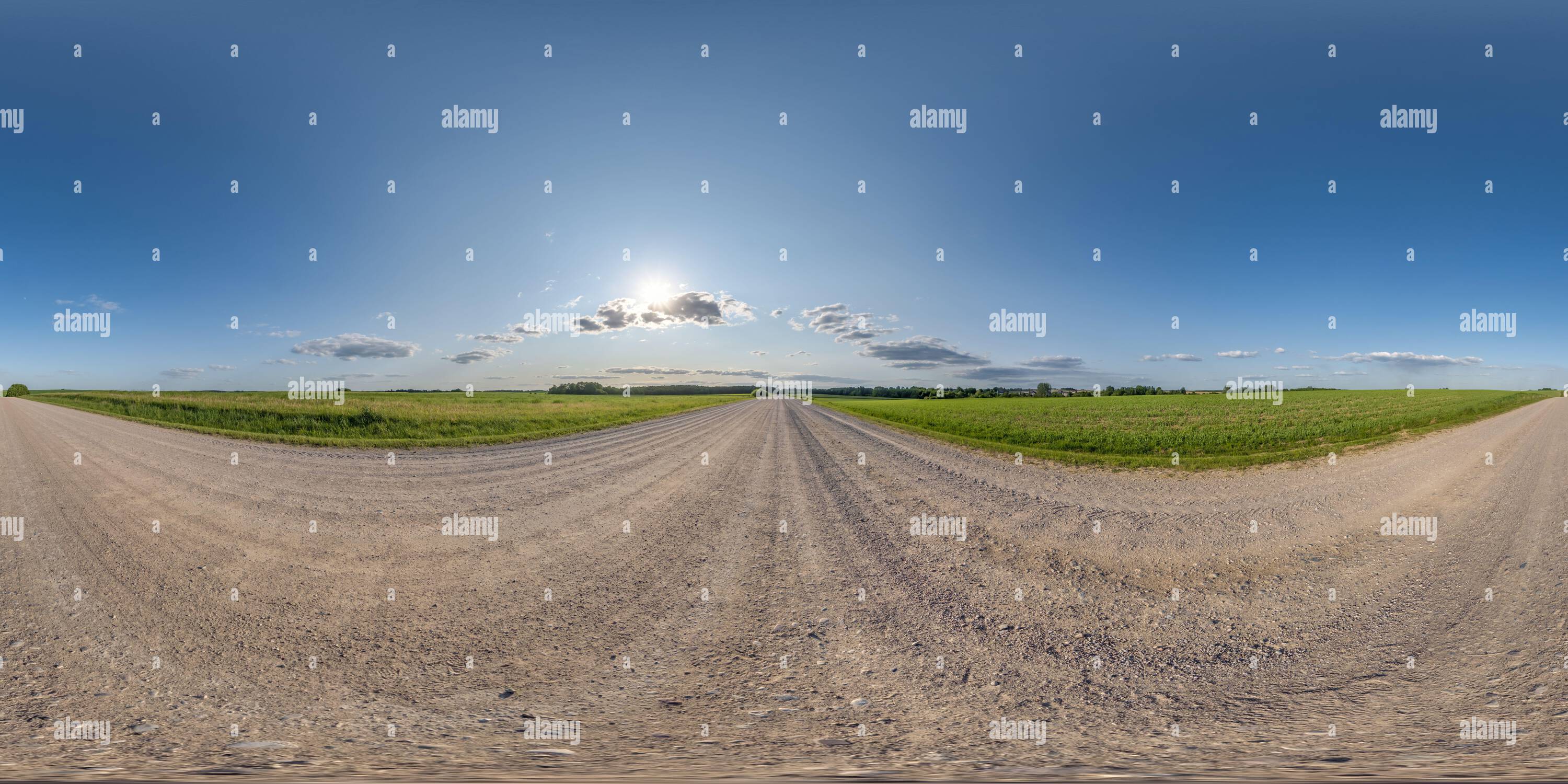 360° view of 360 hdri panorama on gravel road with clouds and sun on ...