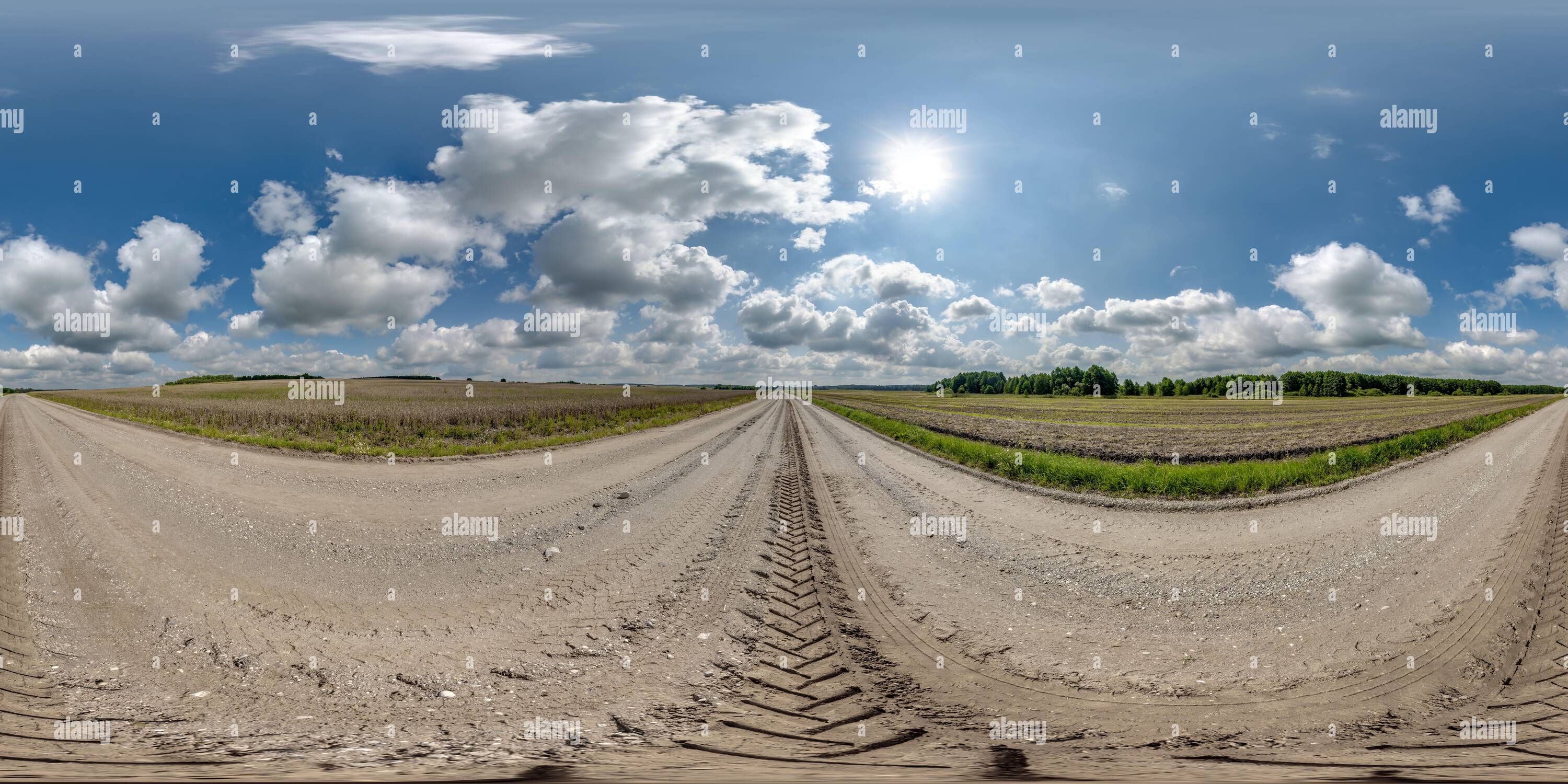 360° view of 360 hdri panorama on wet gravel road with marks from car ...