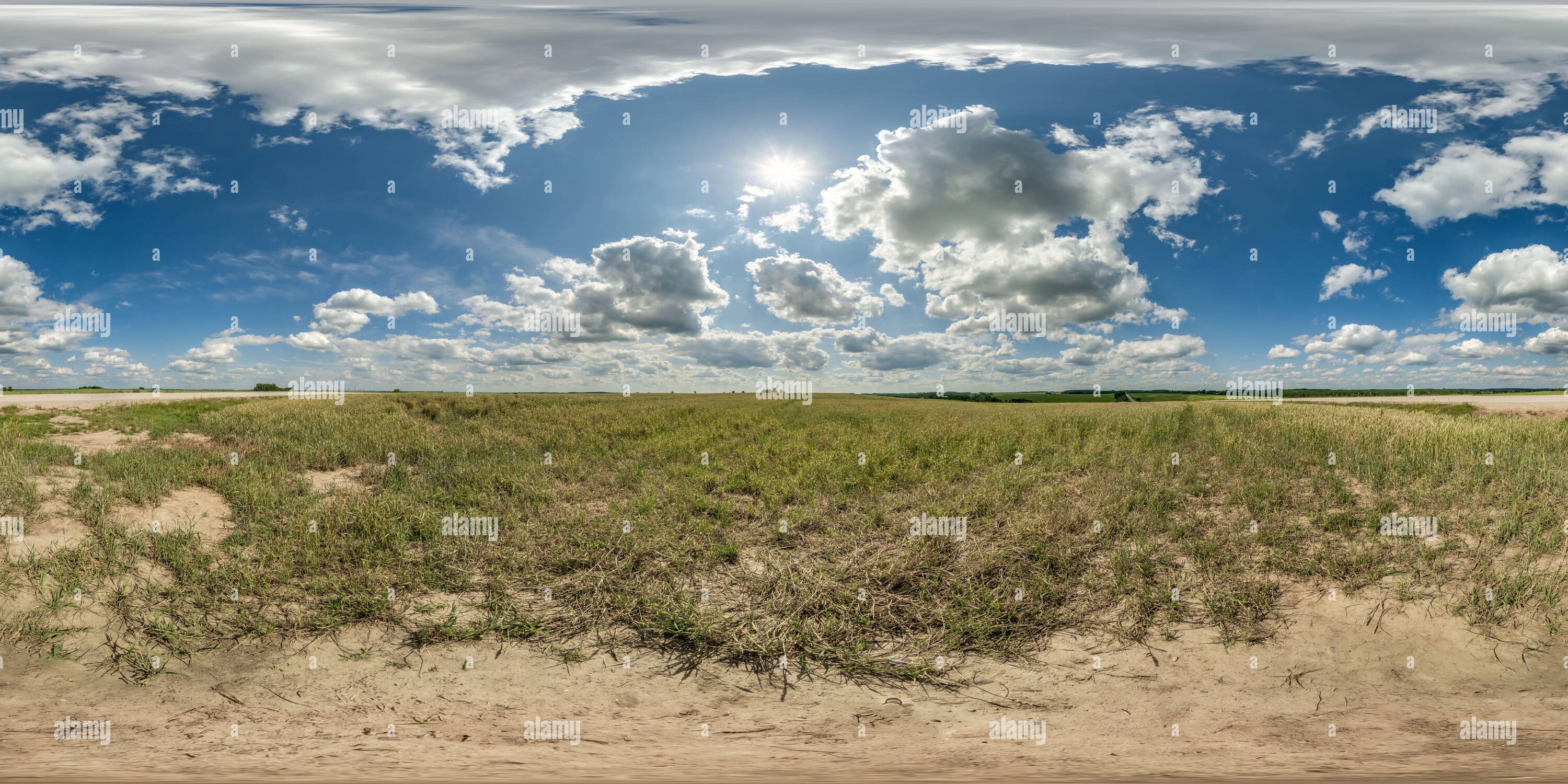 360° view of 360 hdri panorama among dry farming field with clouds on ...