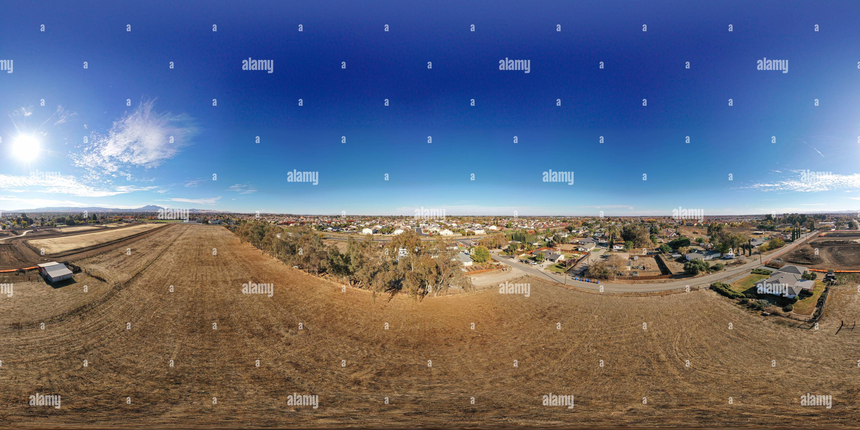 360° view of Aerial 360° drone panorama over a residential neighborhood and adjacent ...