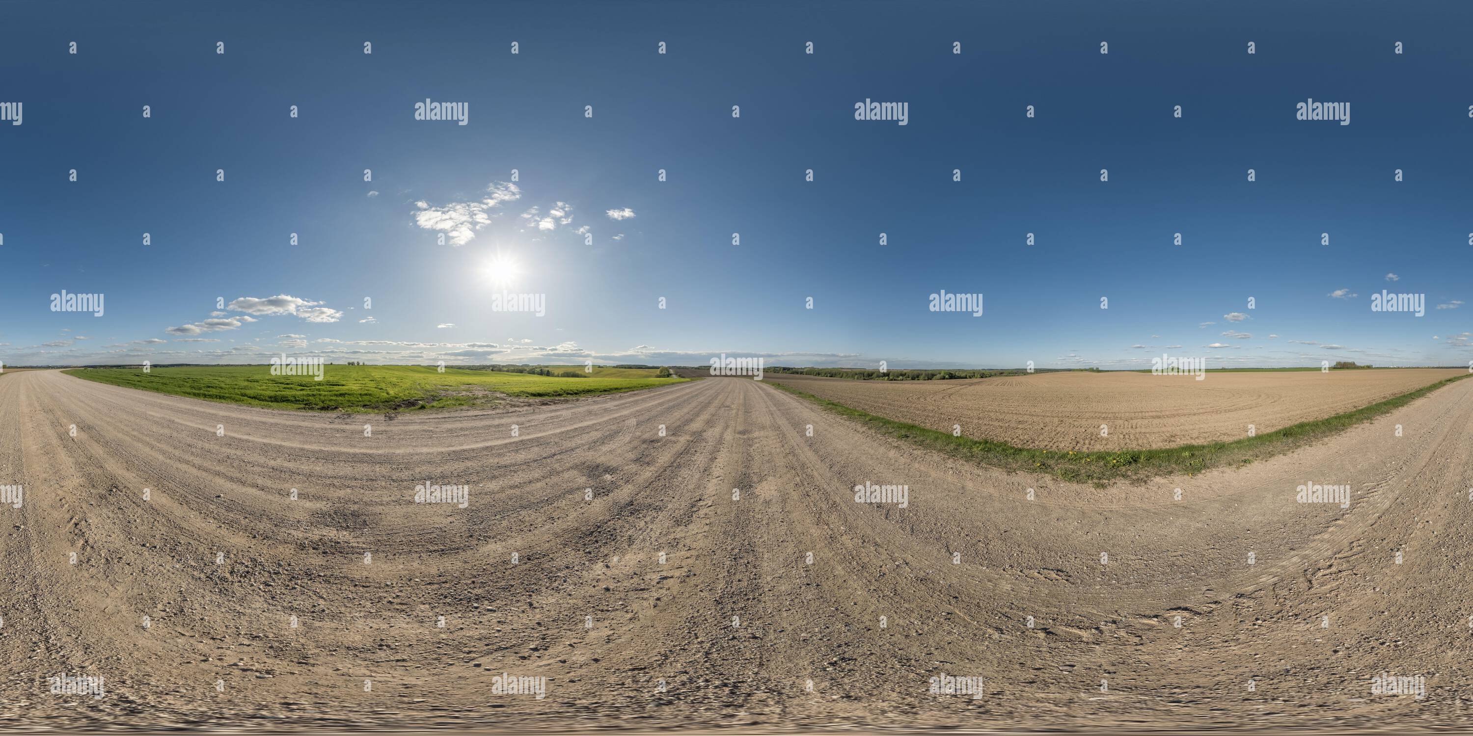 360° view of 360 hdri panorama on gravel road with marks from car or ...