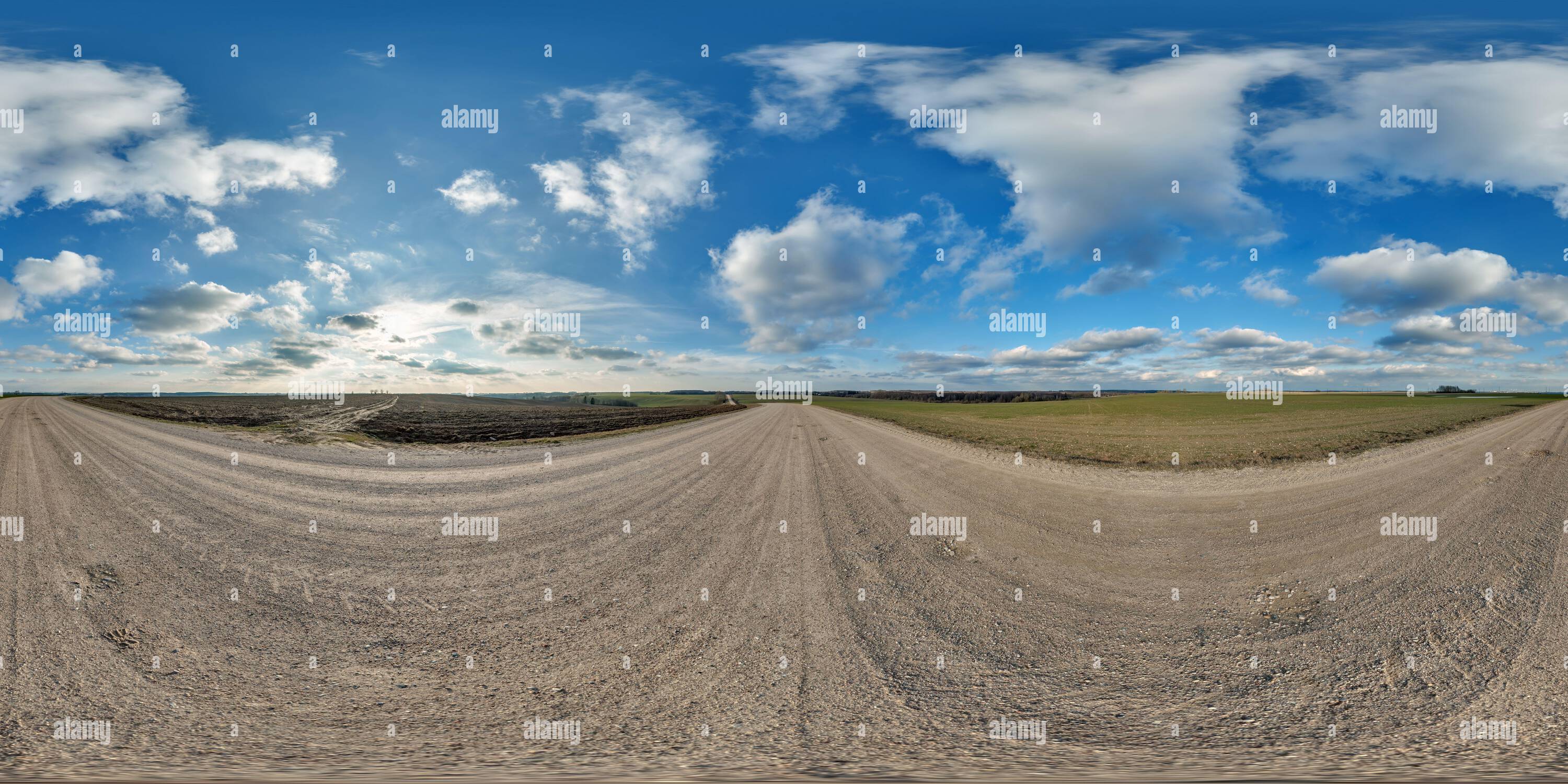 360° view of hdri 360 panorama on gravel road among fields in spring ...