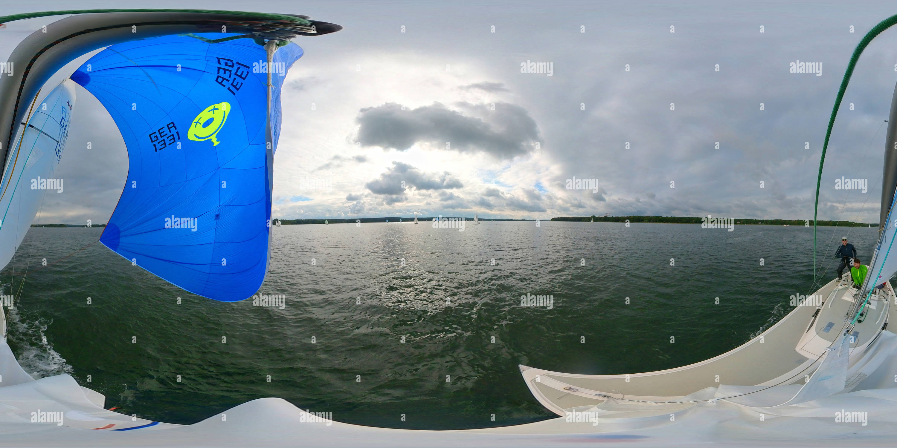 360° view of sporty sailing with blue spinnaker sail - Alamy