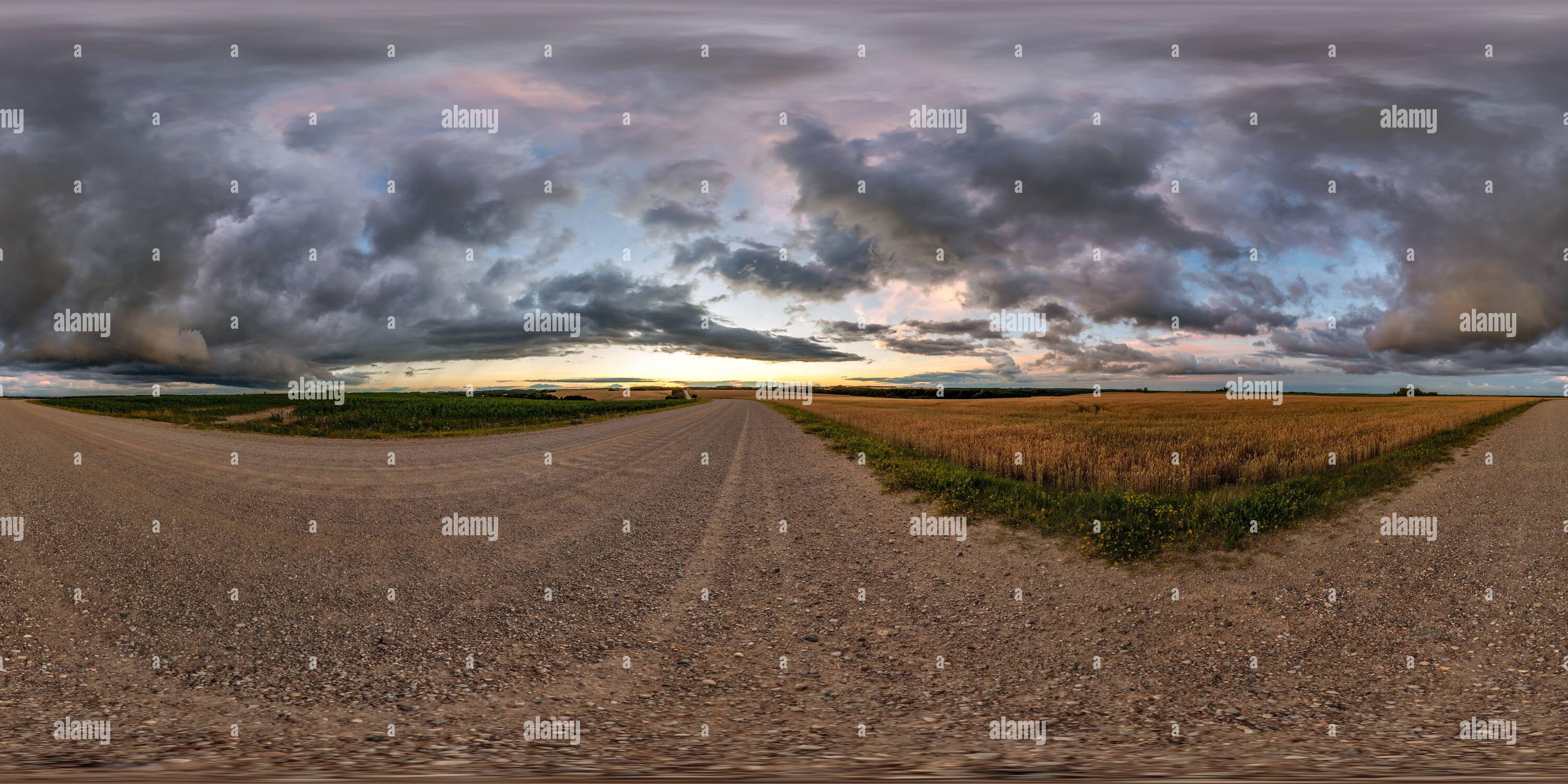 360° view of hdri 360 panorama on gravel road among fields in nasty evening before sunset with ...