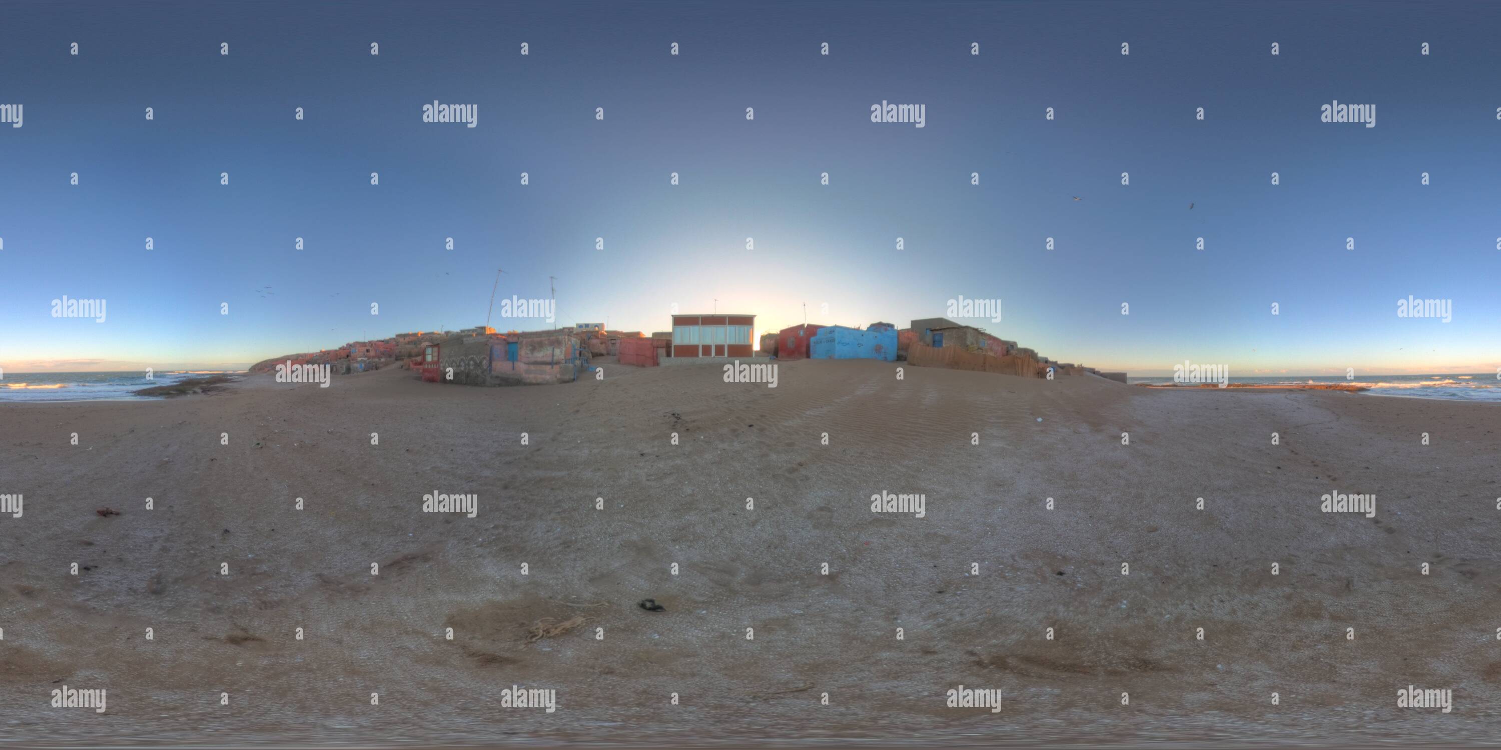 360° view of Camino Surf: Sunrise behind small fisher village of Tifnit ...