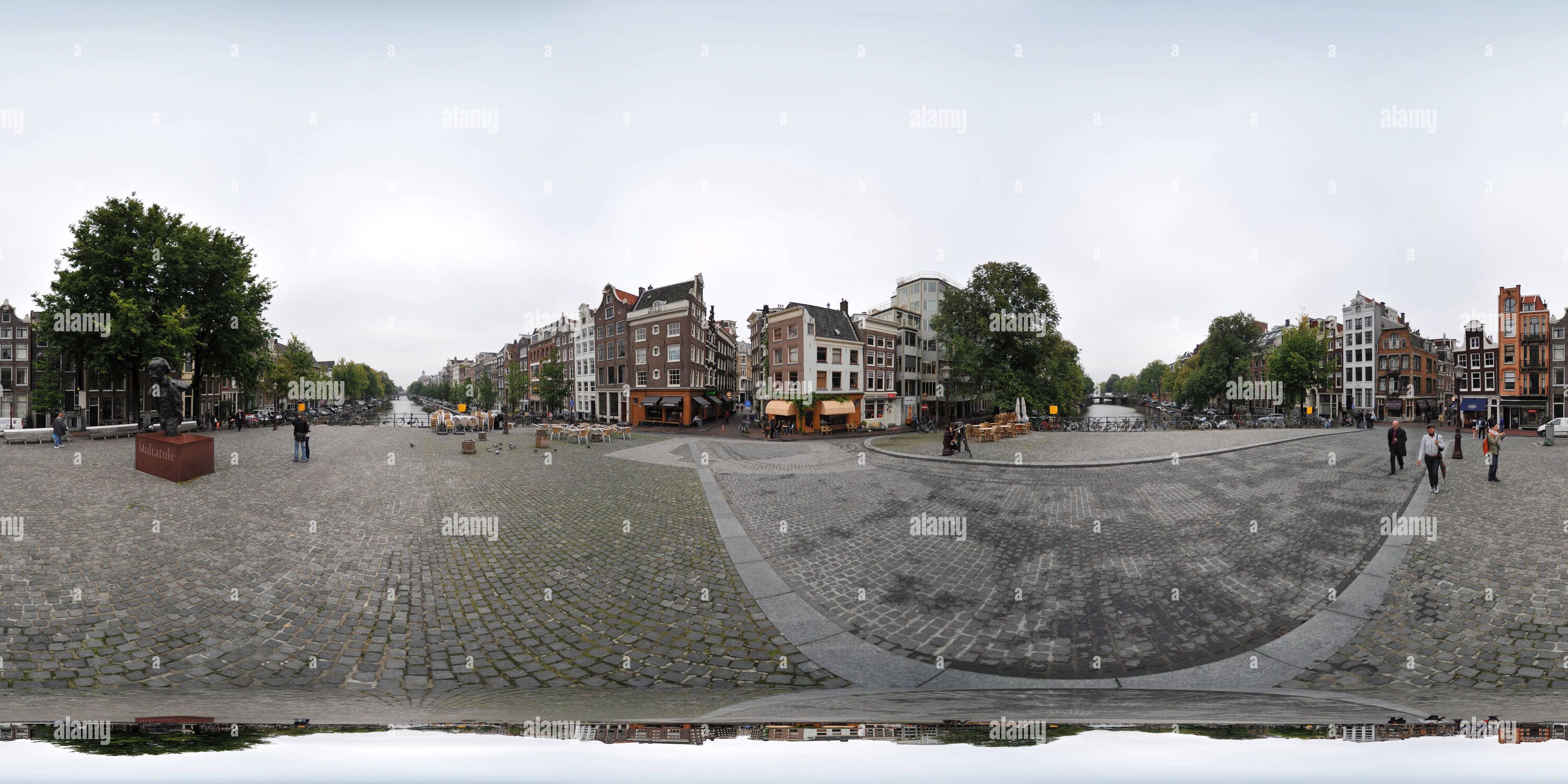 360° view of Statue of Multatuli on a square over the Singel canal in ...