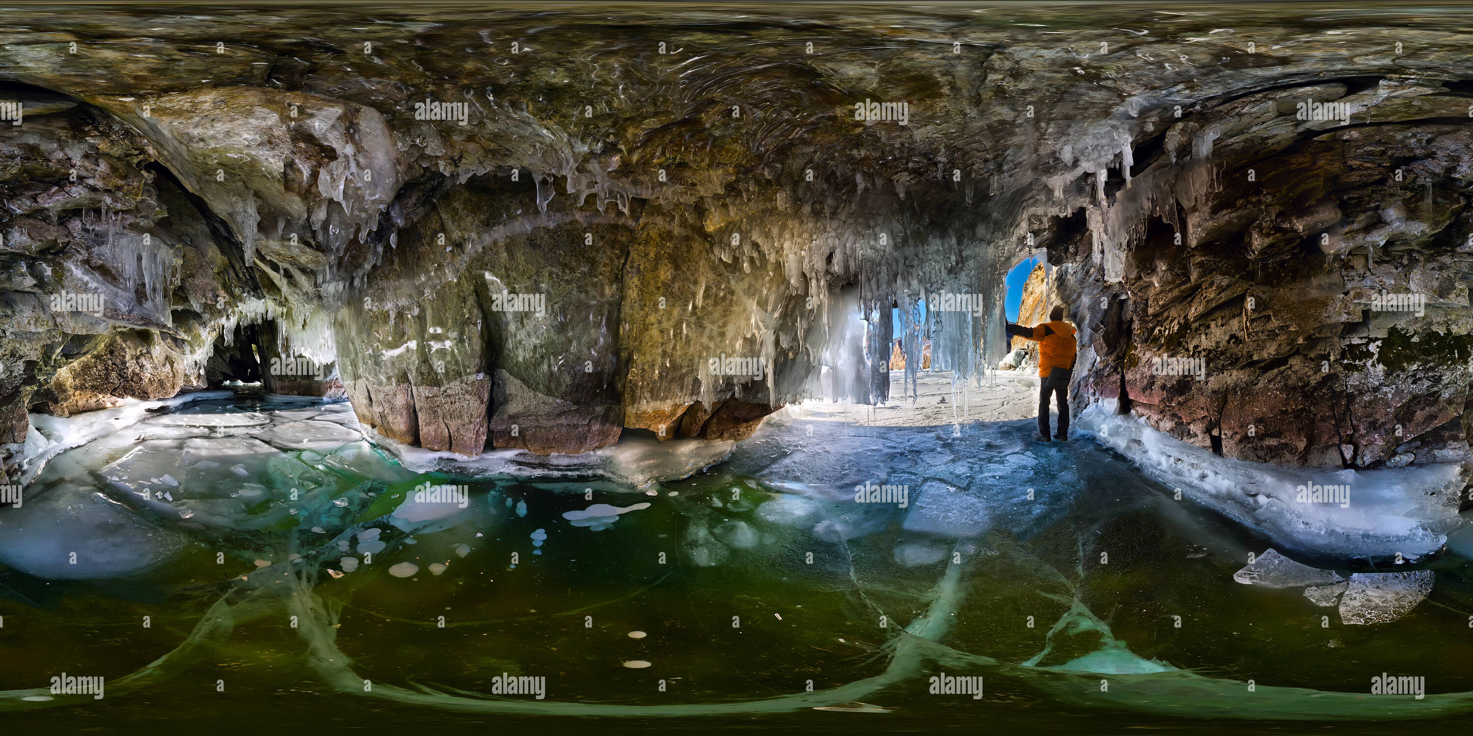 360° view of Panorama man in an ice cave with icicles on Baikal, Olkhon ...