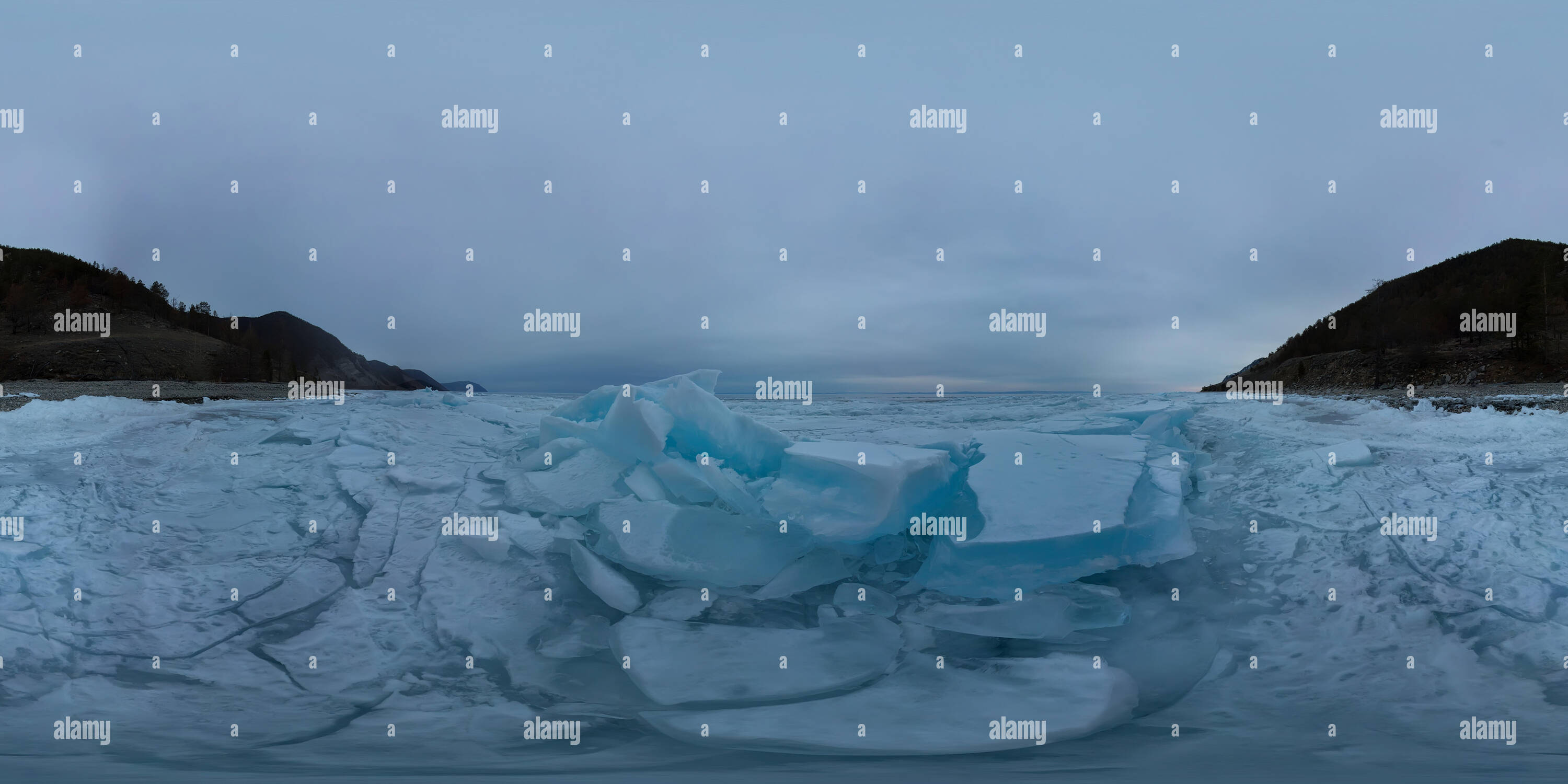 360° view of large blue ice floes on a winter lake Baikal in cloudy ...