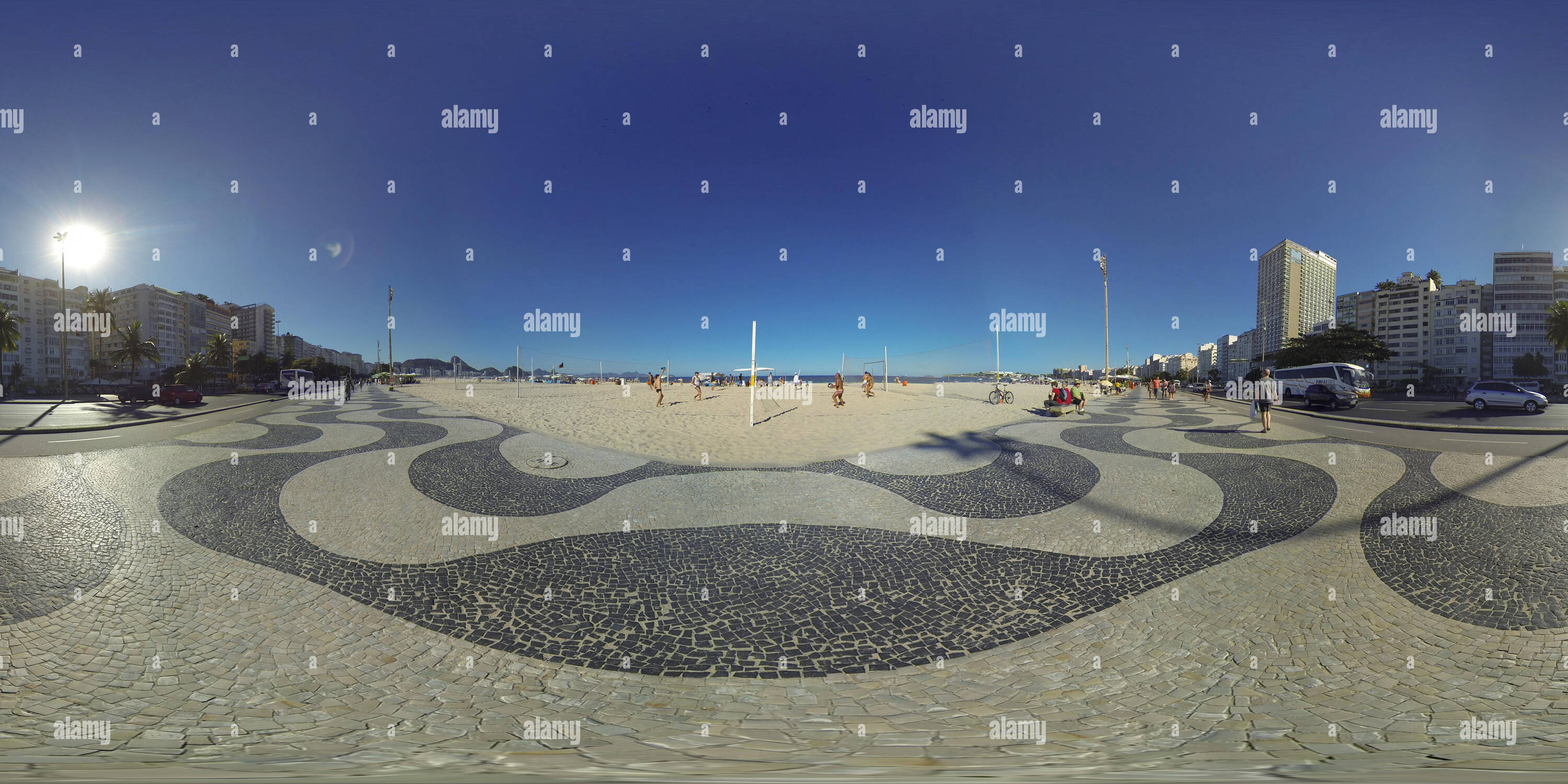 360° view of Rio de Janeiro, Brazil: People play with ball on sand on ...