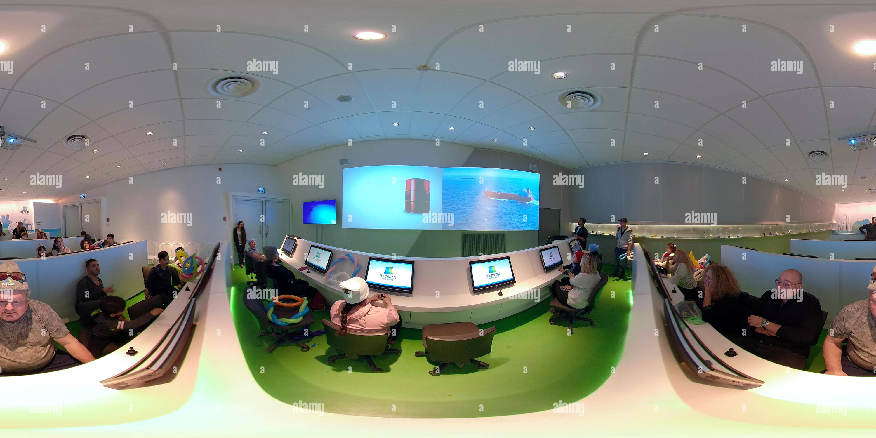 360° view of Children and adults watch a presentation at Bazan oil ...