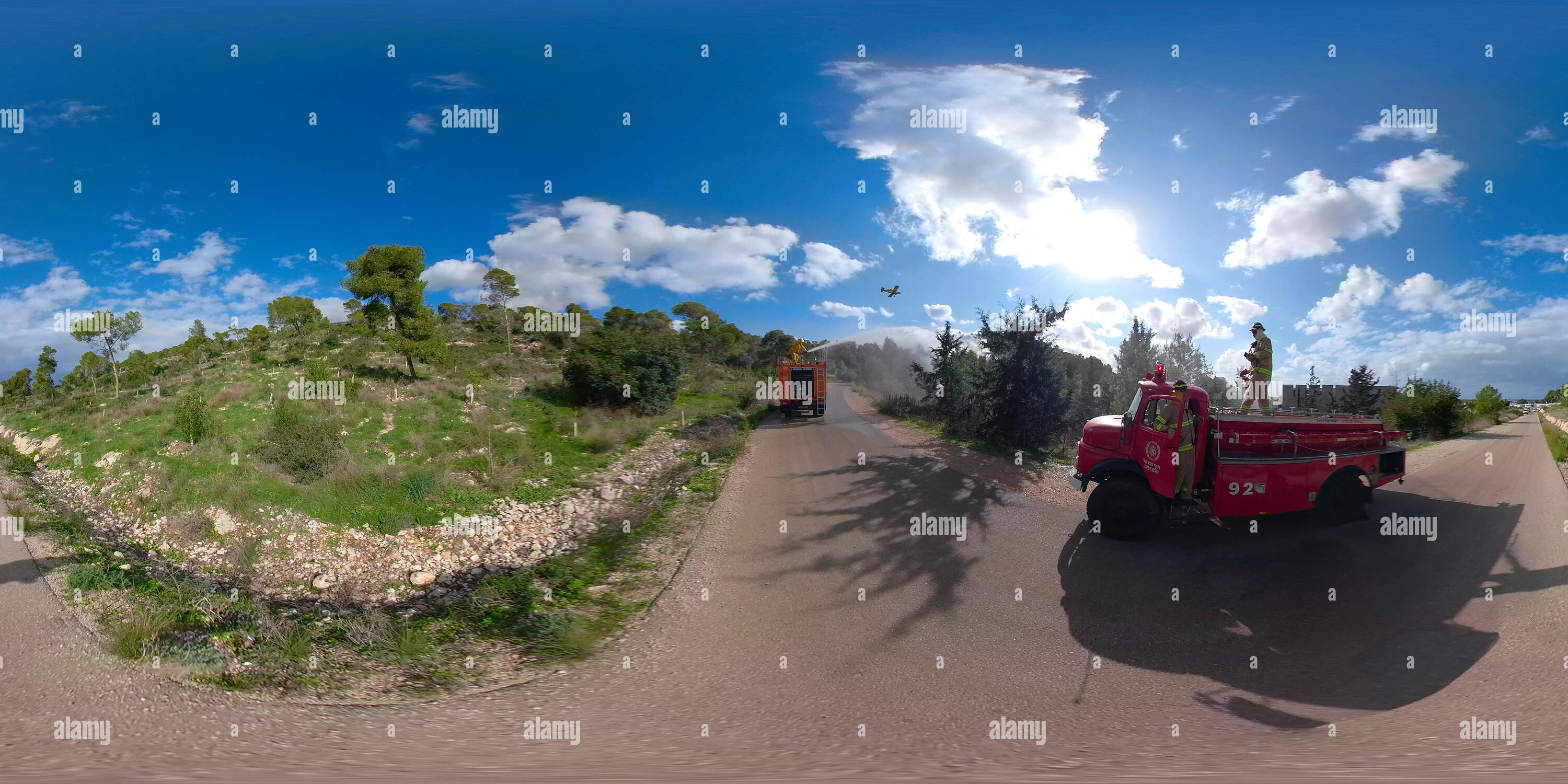 360° view of Firefighting airtanker drop fire retardant on burning ...