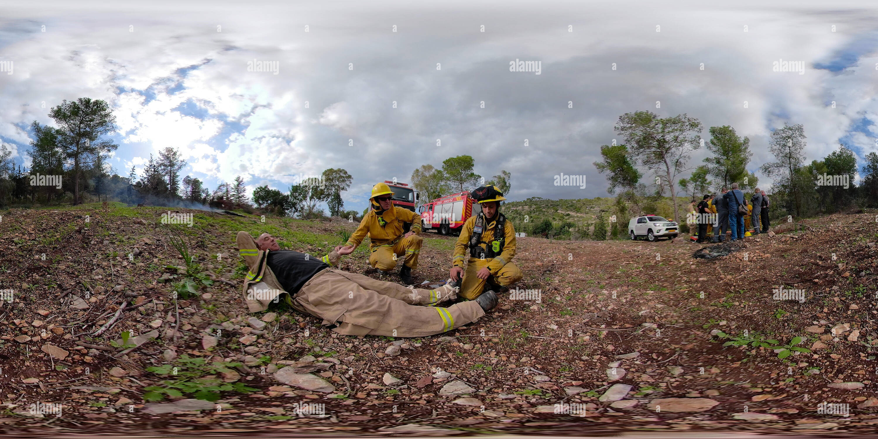 360° view of Firefighter and paramedic help an injured firefighter ...