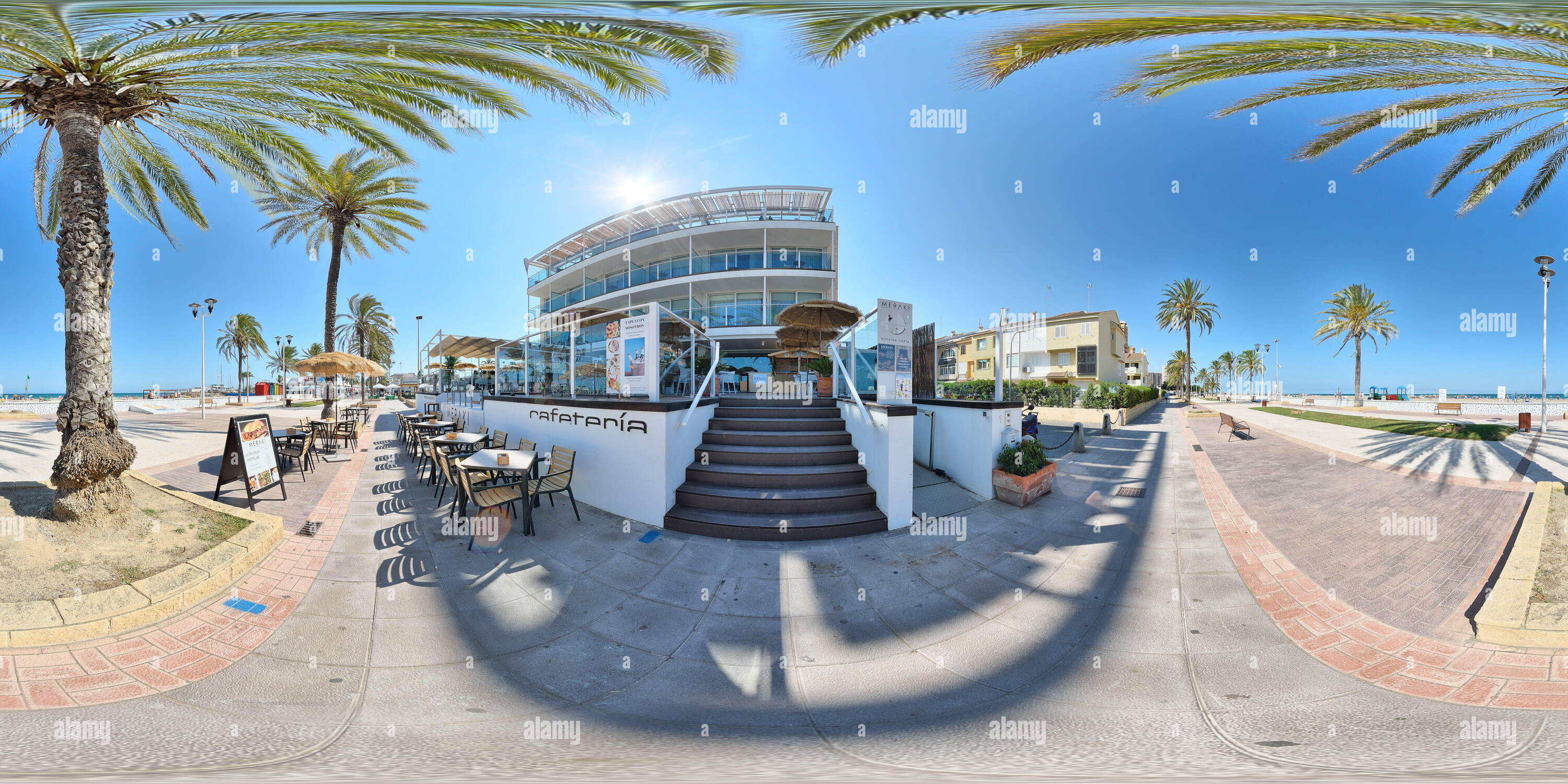 360° view of Sunny boardwalk next to hotel with terrace - Alamy
