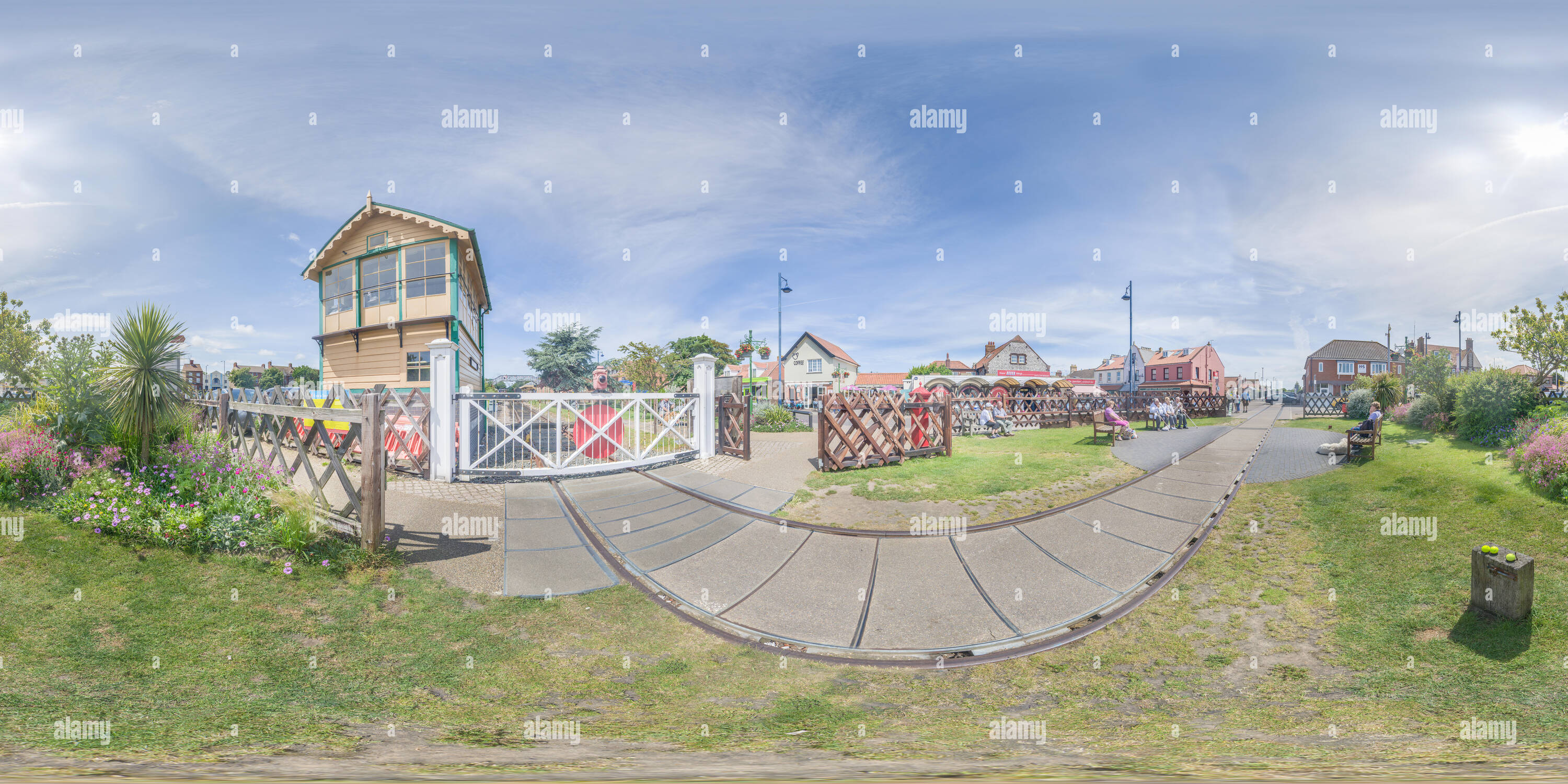 360° view of Relaxing by the railway on a hot day at the seaside resort ...